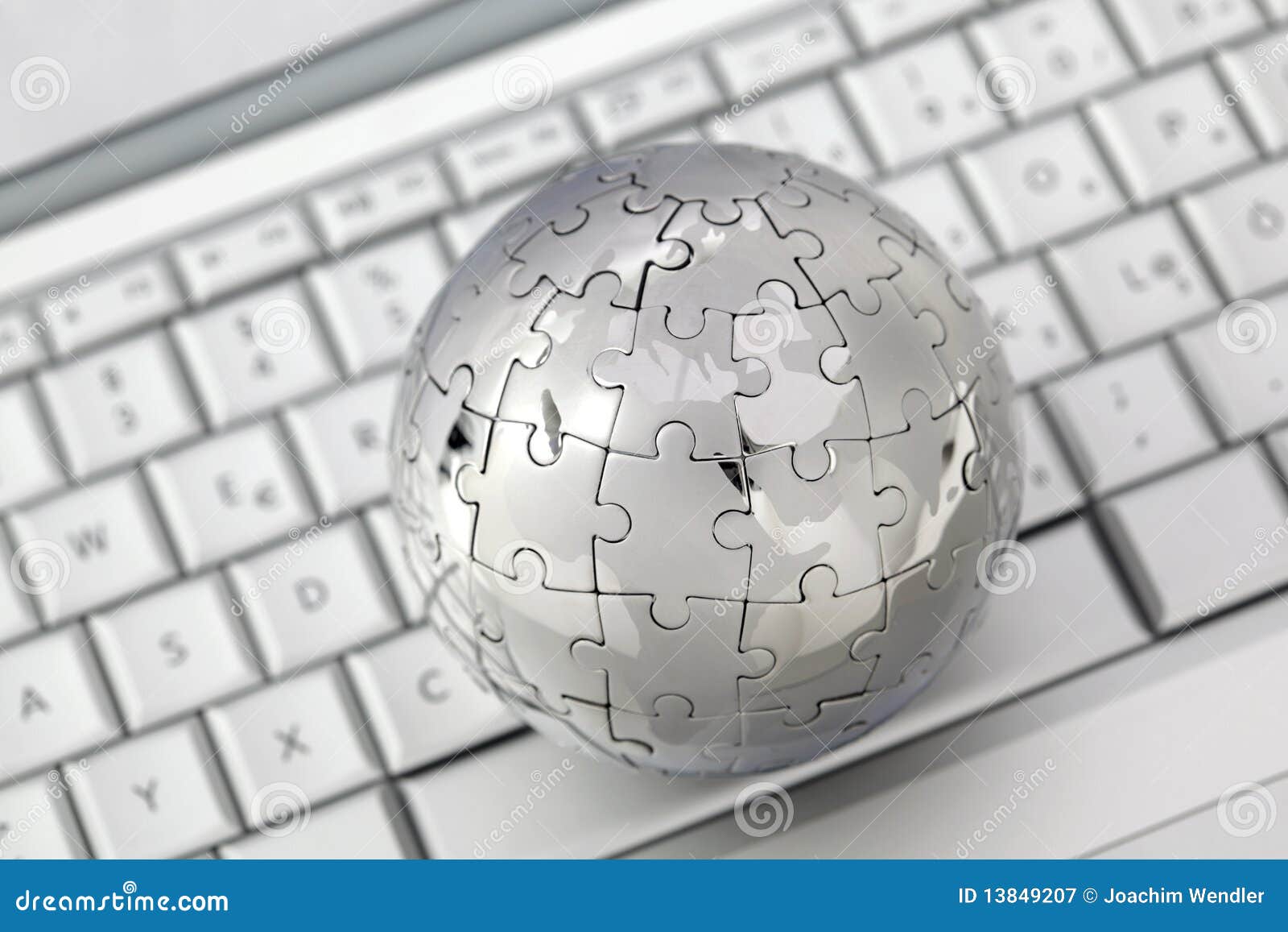 Metal Puzzle Globe on Keyboard Stock Image - Image of development ...