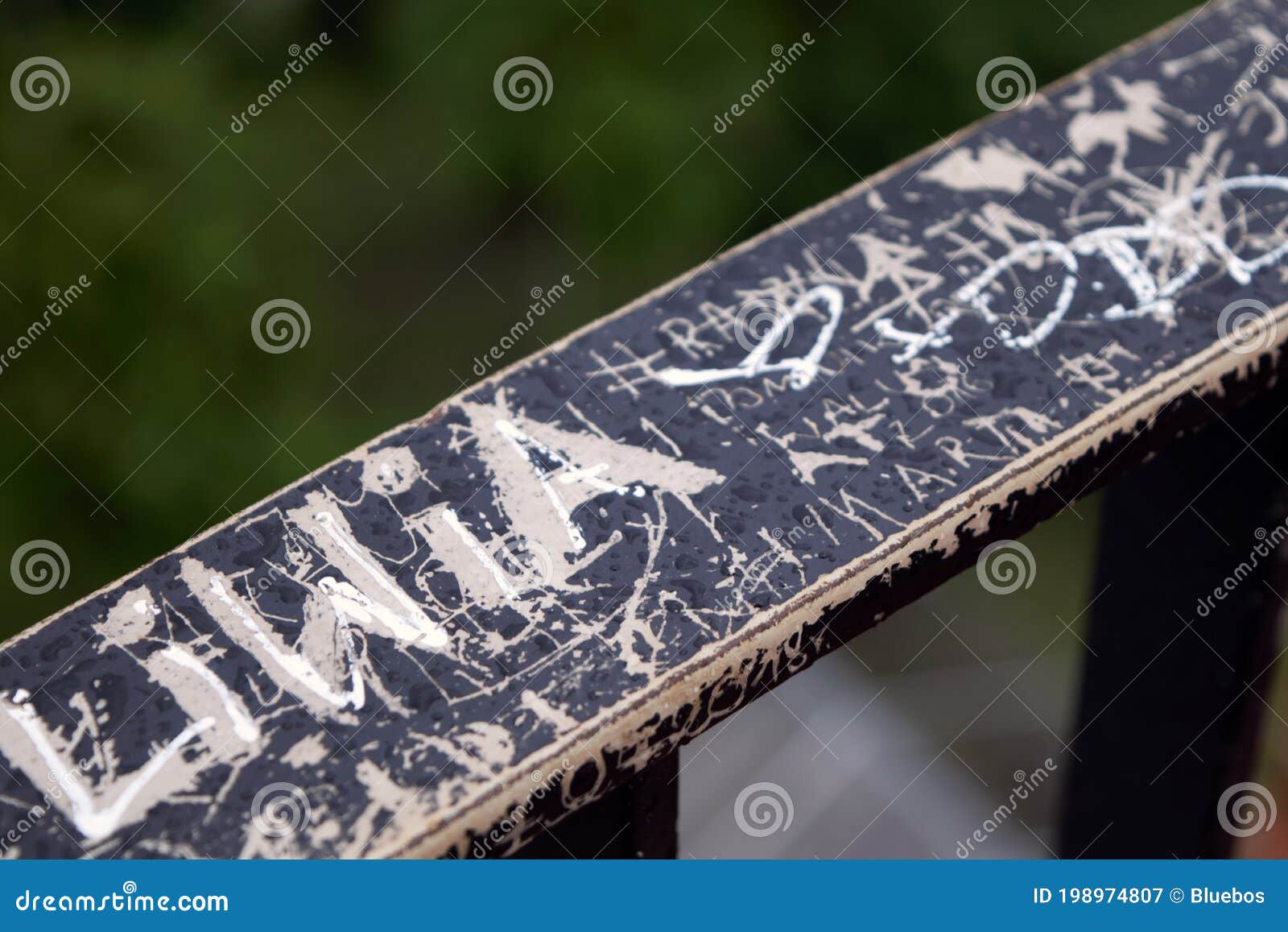 Metal Railing with Patterns Scratched into the Paint and Engraved with ...