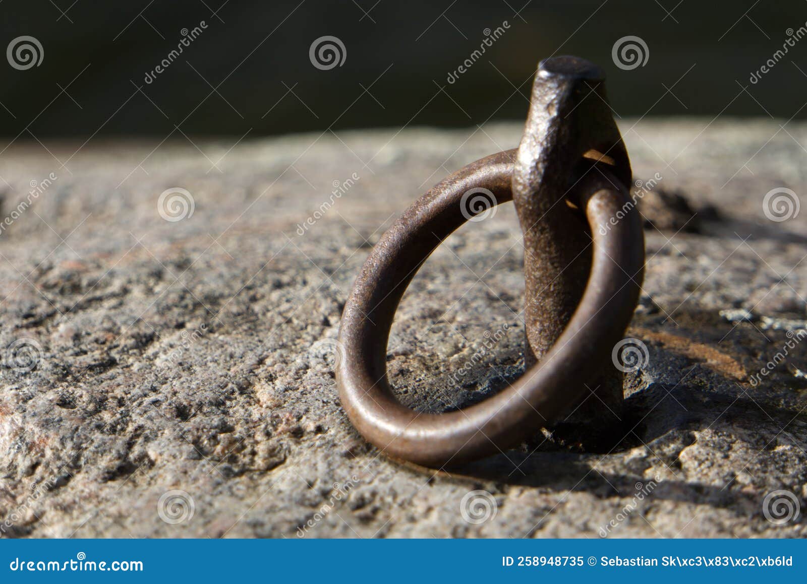 Metal Ring in Rock by the Shore Stock Image - Image of shadow, hard ...