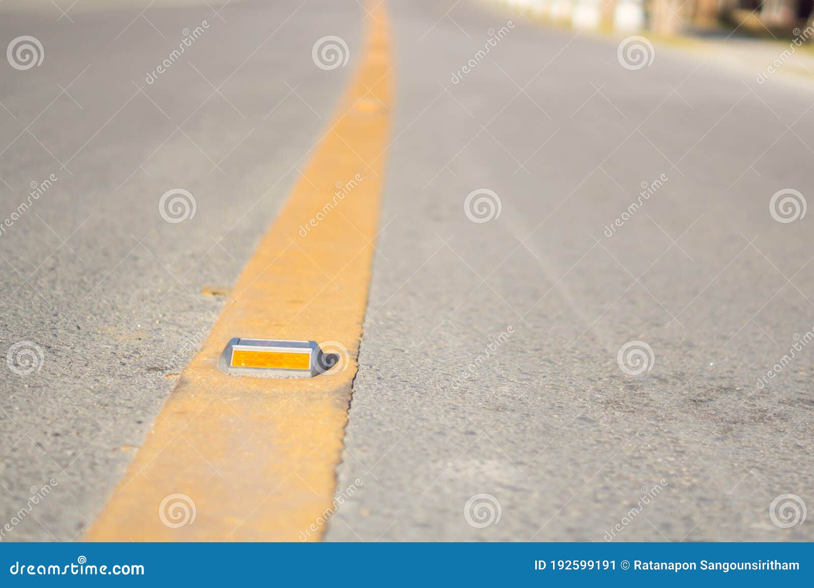 Metal Road Stud with Yellow Line on the Road Stock Image - Image of ...