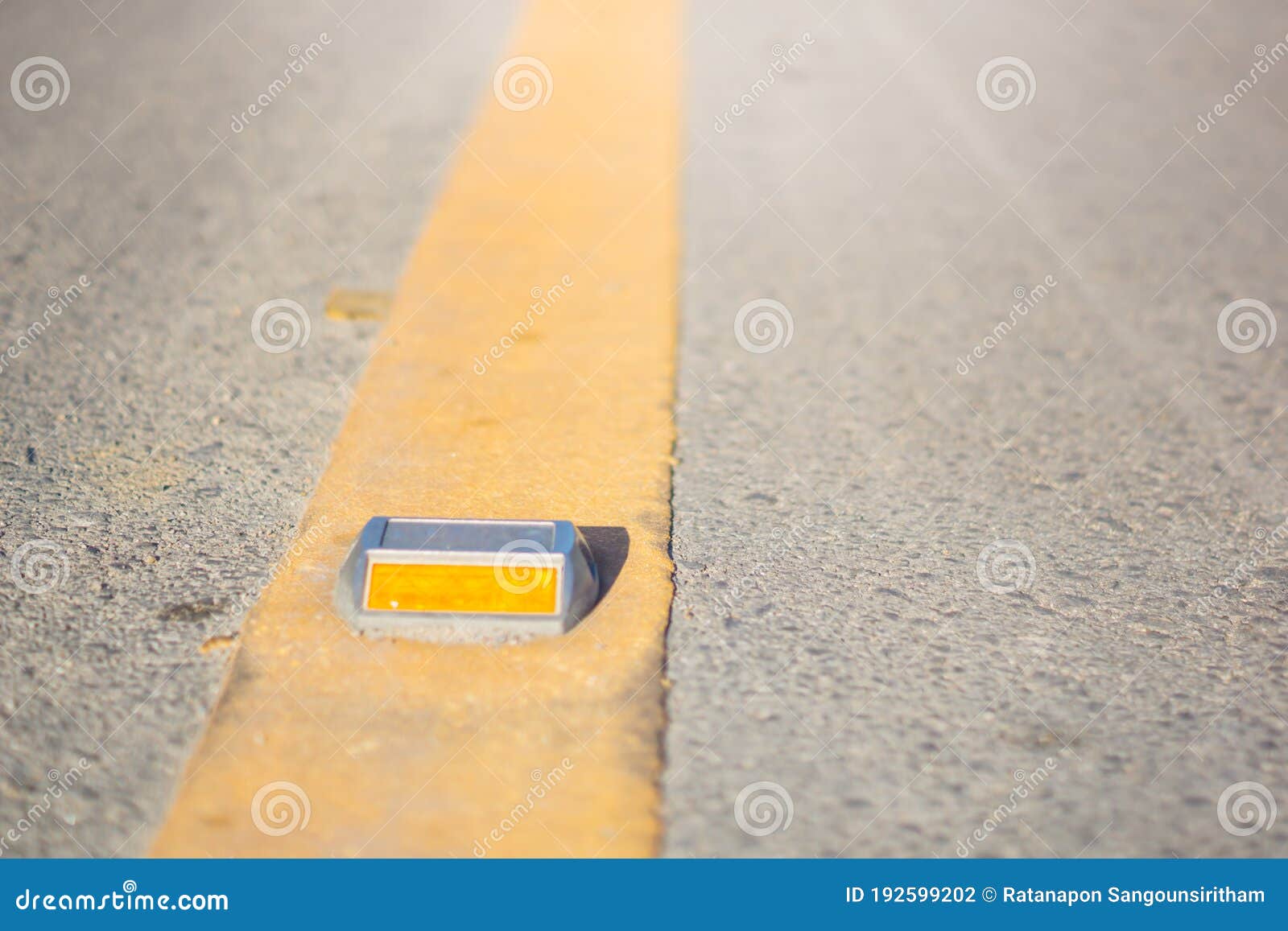 Metal Road Stud with Yellow Line on the Road Stock Photo - Image of ...