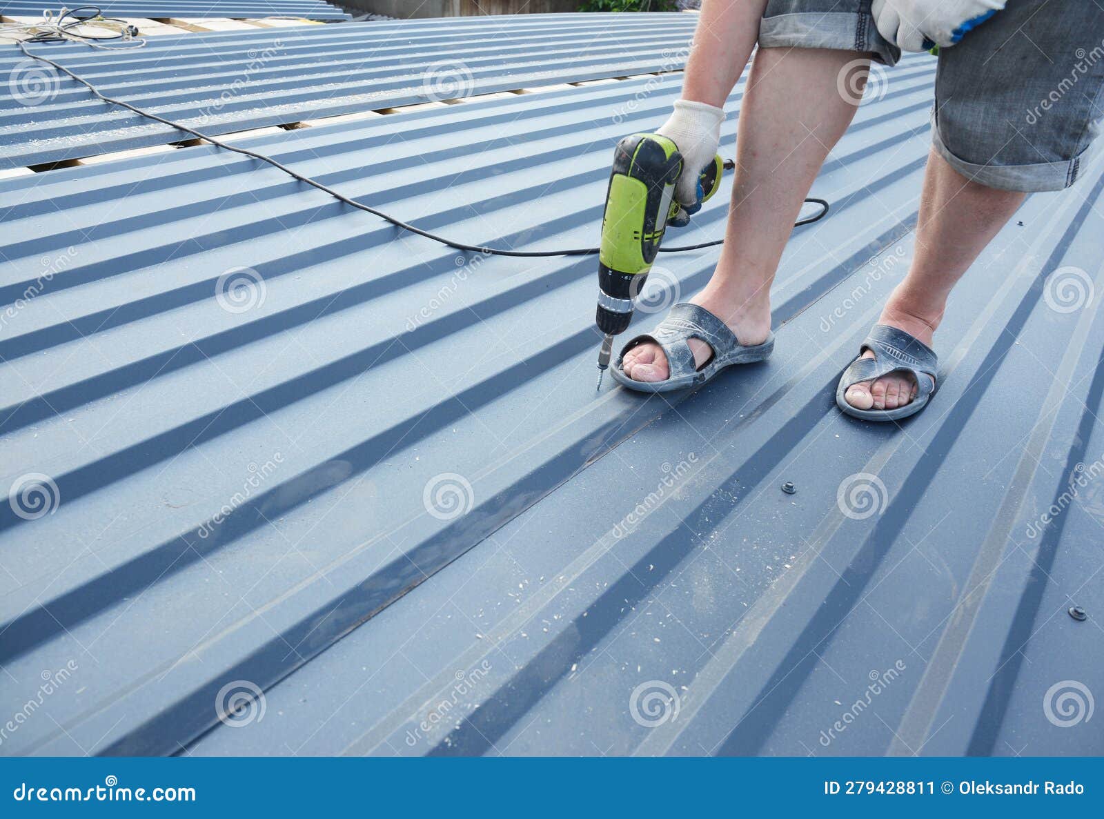 Metal Roof Installation. Roofing Contractor is Installing Profile ... Metal Roof Installation. Roofing Contractor is Installing Profile ...