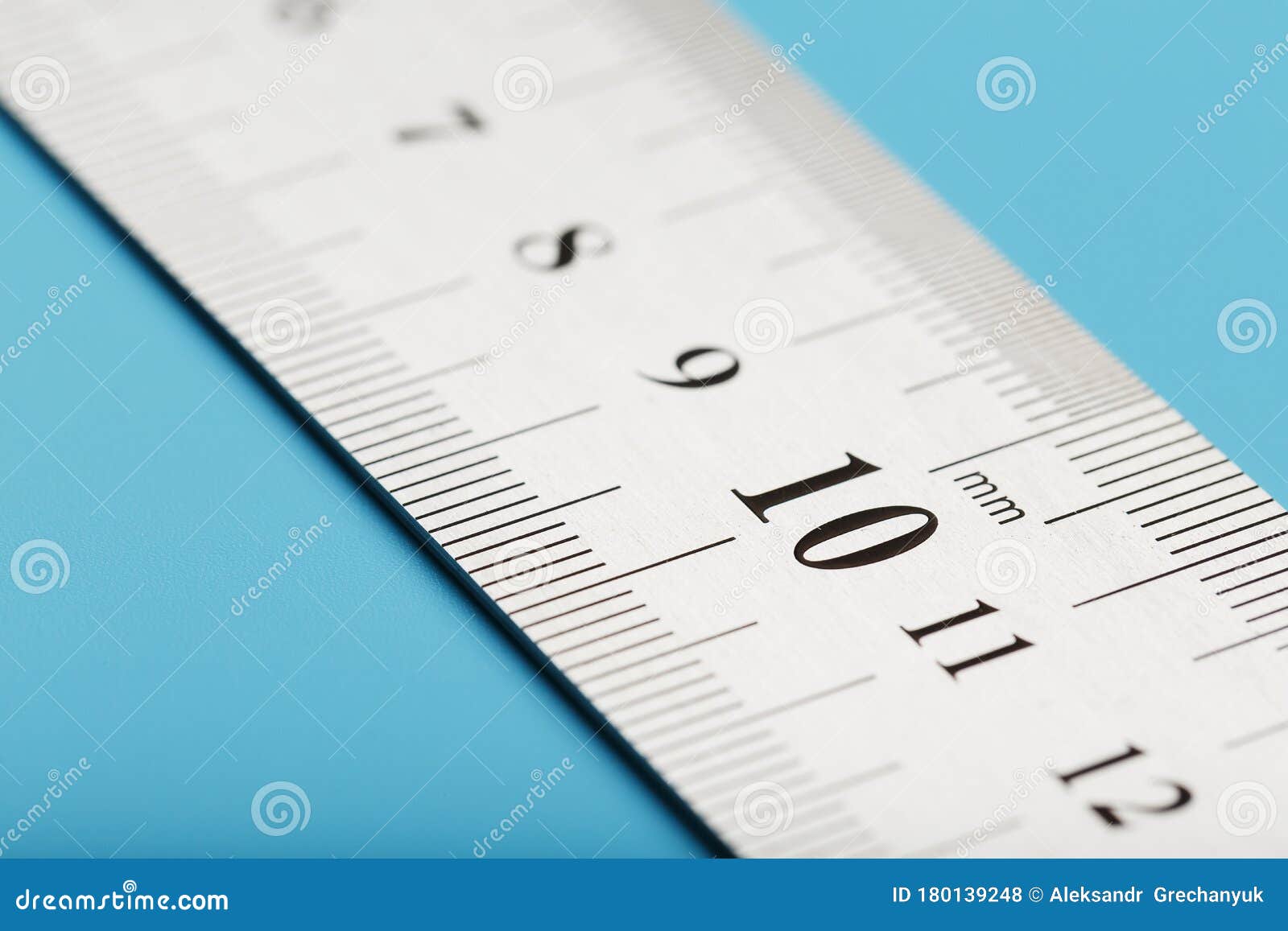 Metal Ruler on a Blue Background Close-up with a Copy of the Space for ...