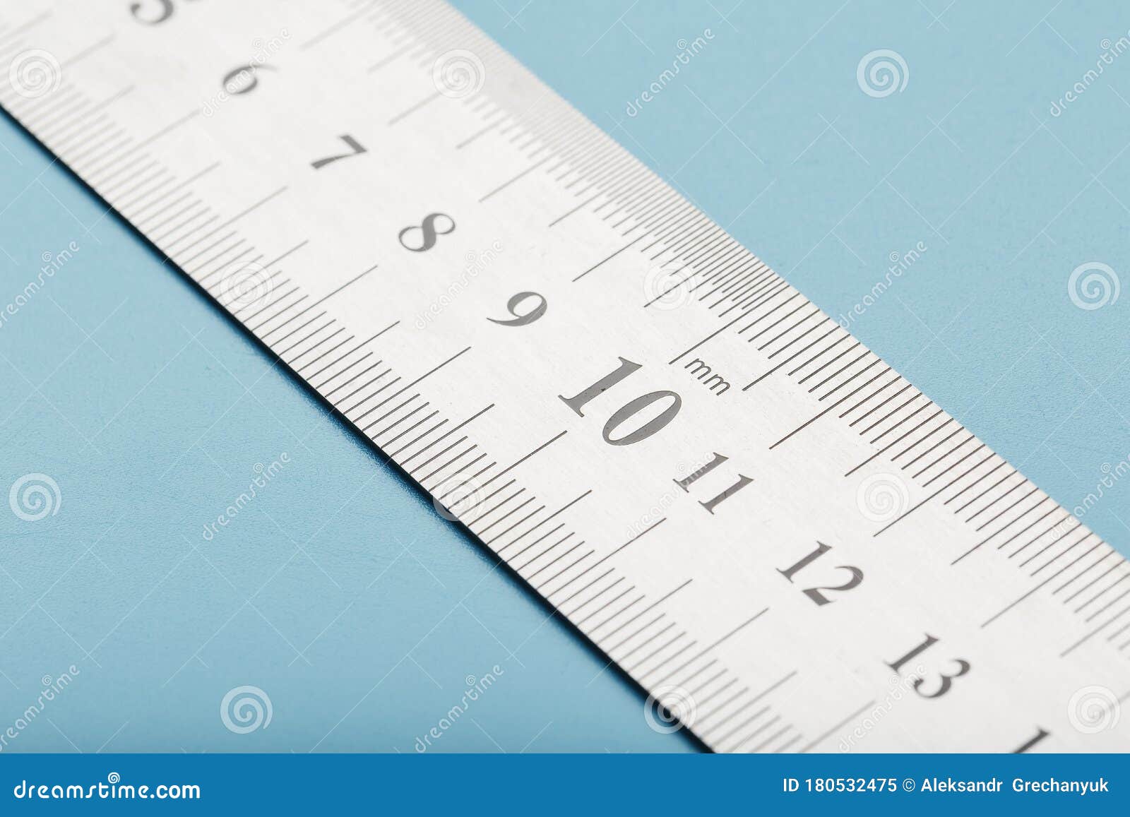Metal Ruler on a Blue Background Close-up with a Copy of the Space for ...