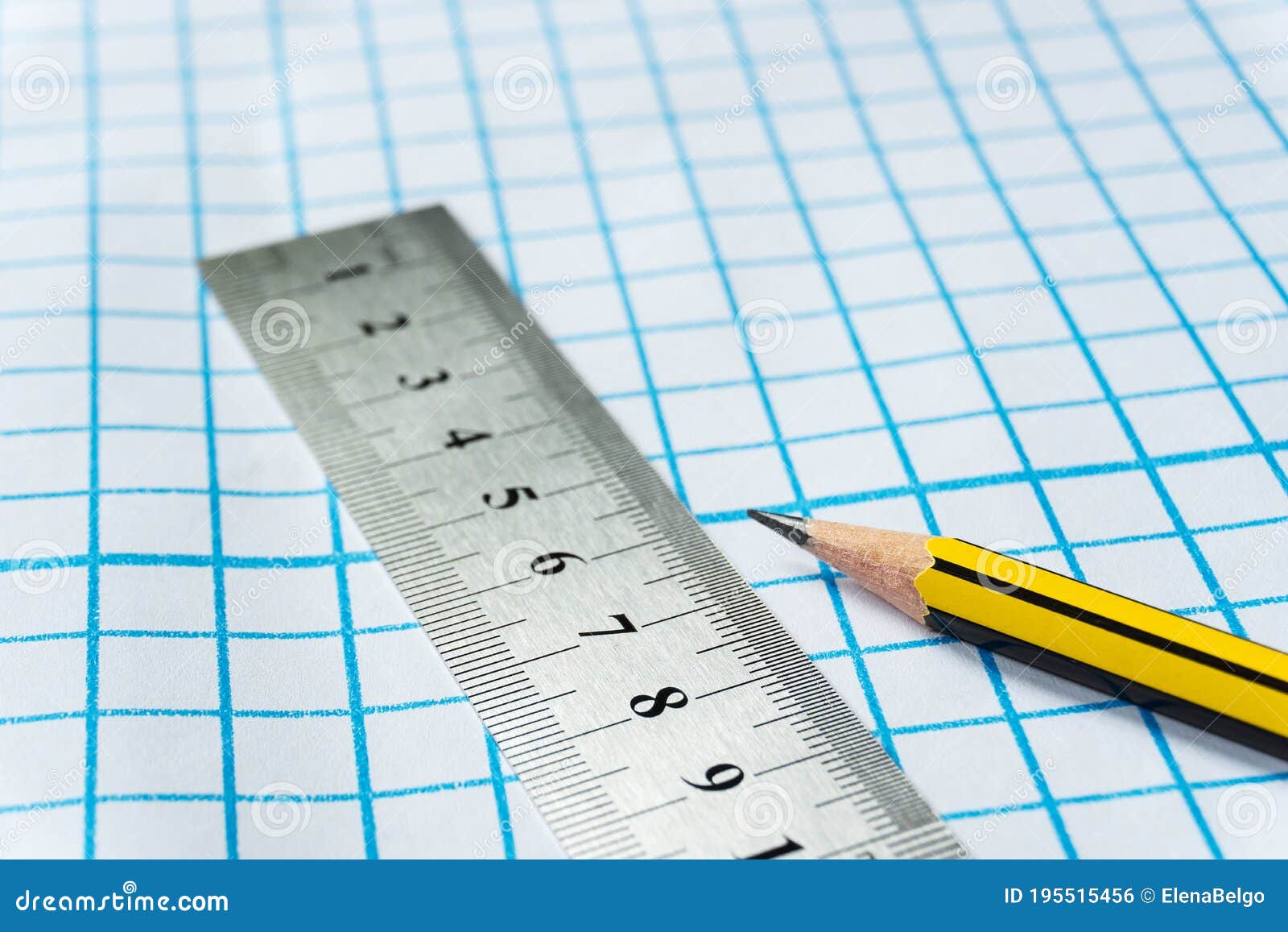 Metal Ruler and a Pencil on Graph Paper. Stock Photo - Image of ...