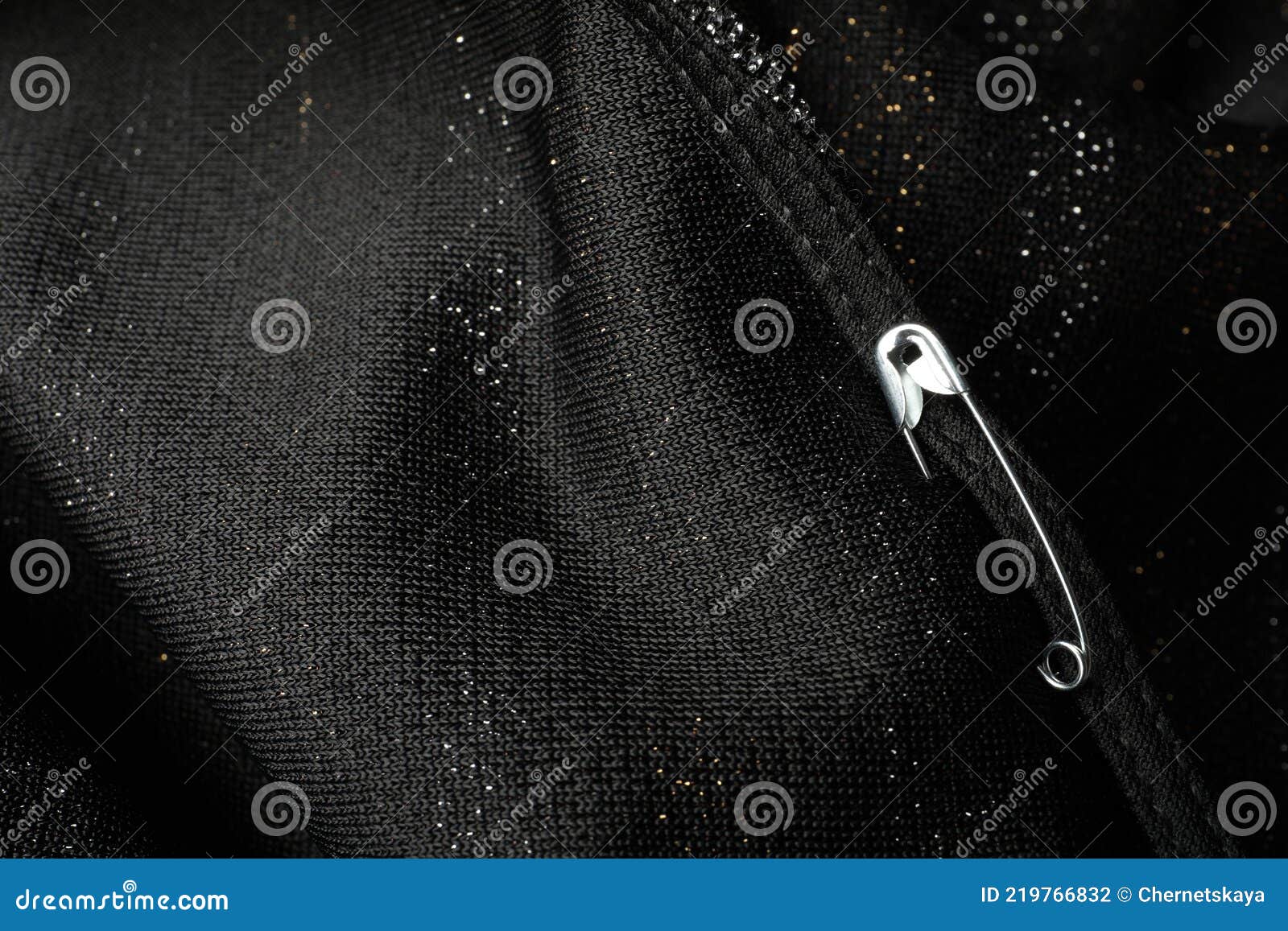Metal Safety Pin on Black Fabric, Closeup Stock Photo - Image of ...