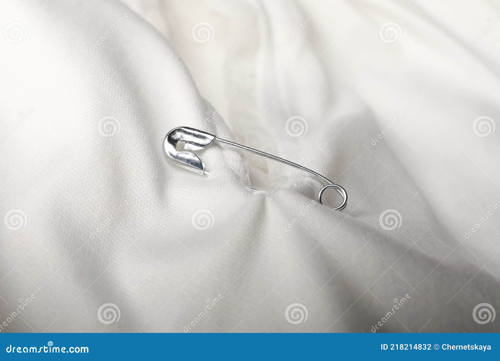 Metal Safety Pin on White Fabric, Closeup Stock Photo - Image of item ...