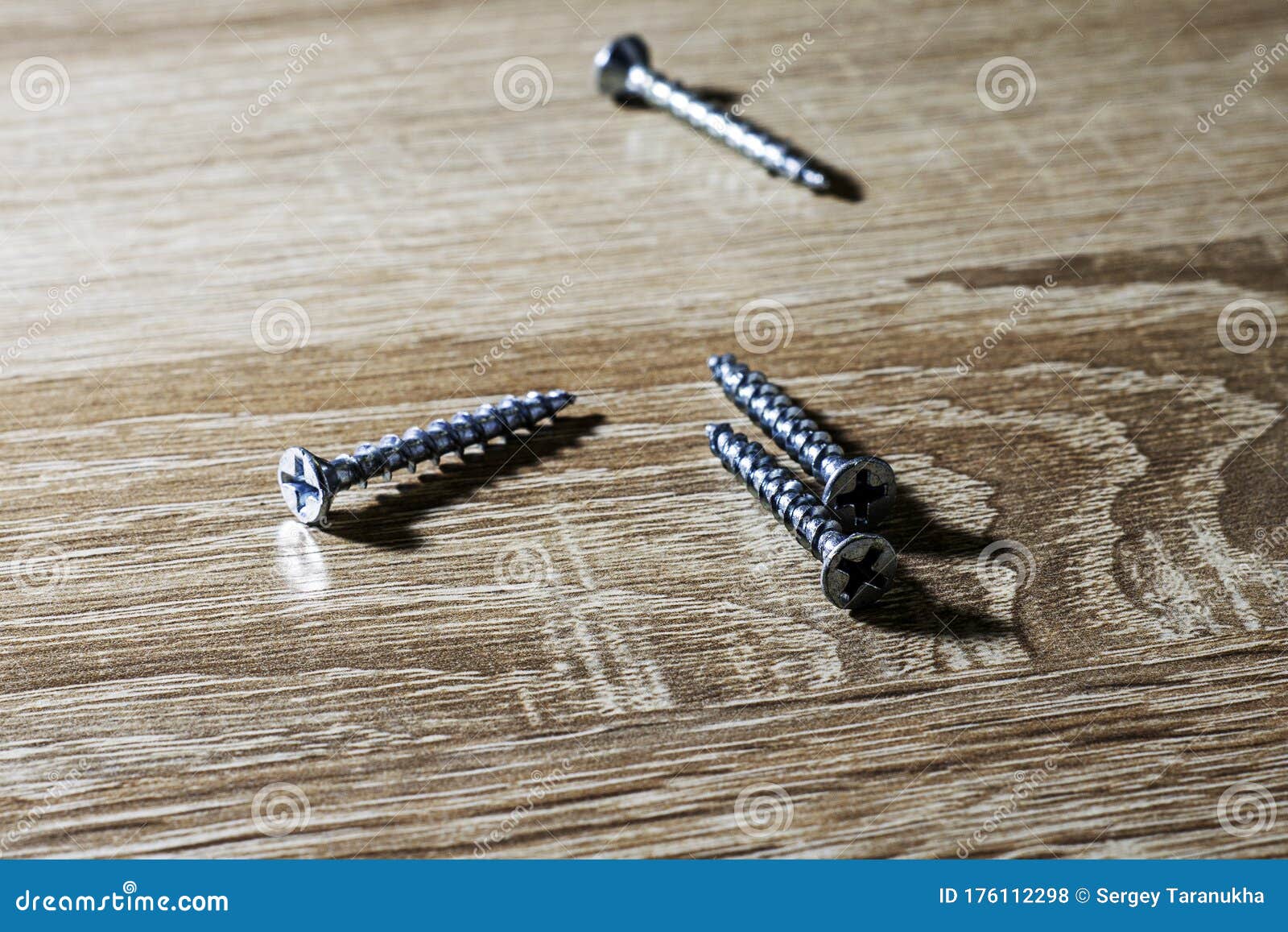Metal Screws Lying on the Wooden Table Stock Photo - Image of ...