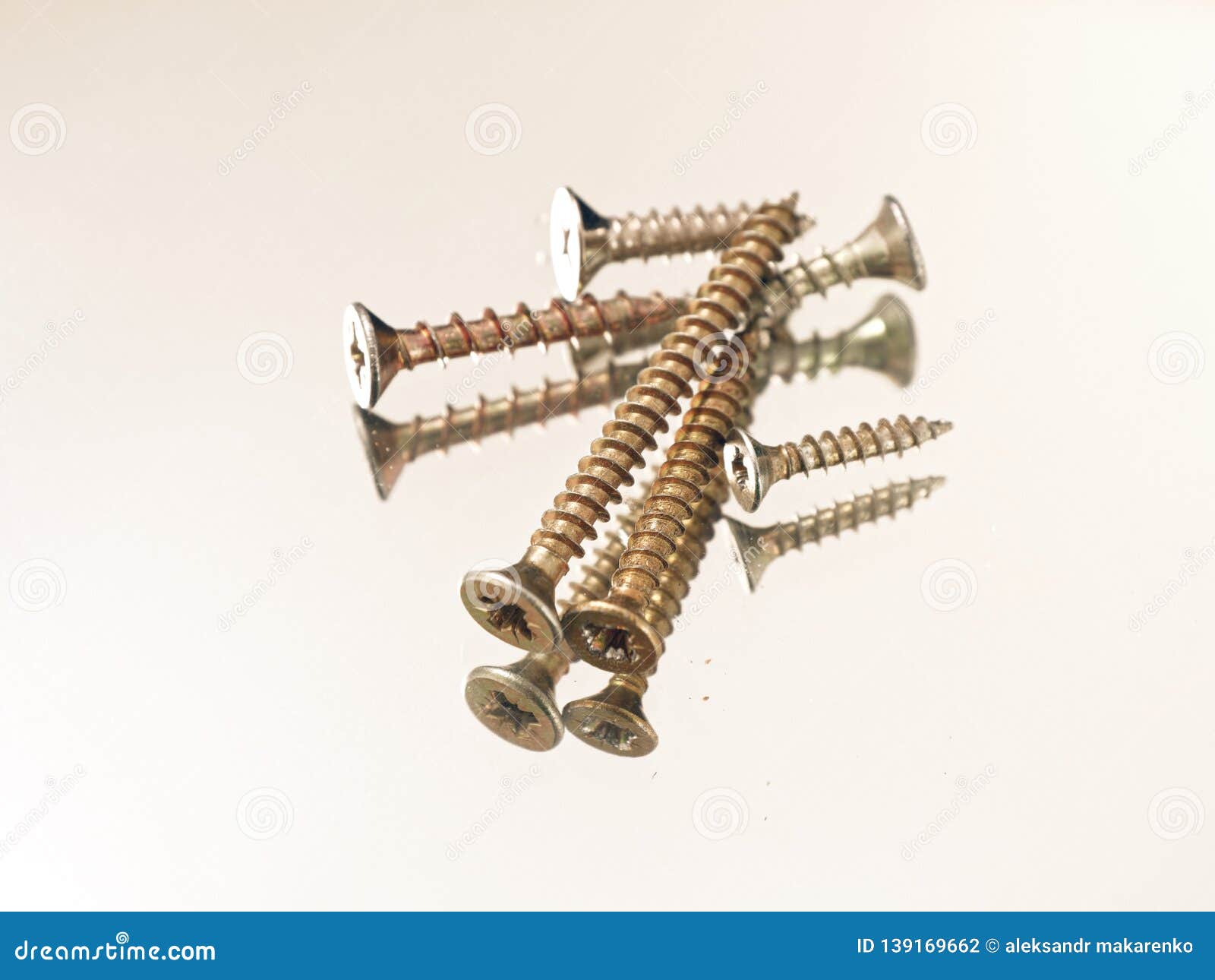 Yellow Hardware Screws on a White Background Stock Photo - Image of ...