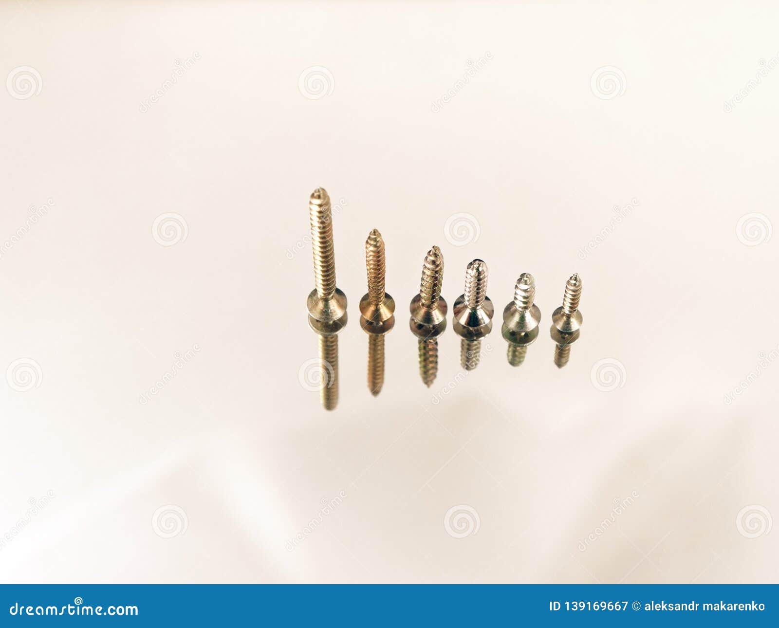 Yellow Hardware Screws on a White Background Stock Image - Image of ...