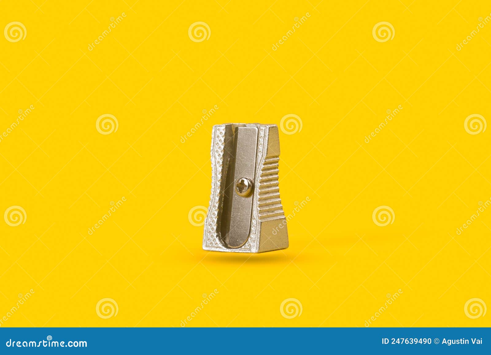 Metal Sharpener Floating on a Yellow Background Stock Photo - Image of ...