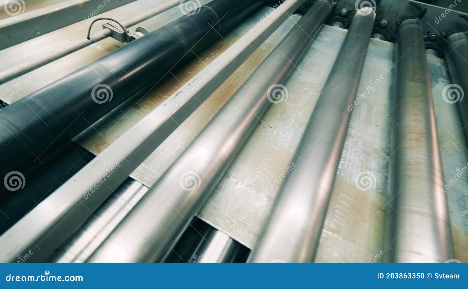 Metal Sheet Moving through Rollers at Metal Working Factory Stock ...