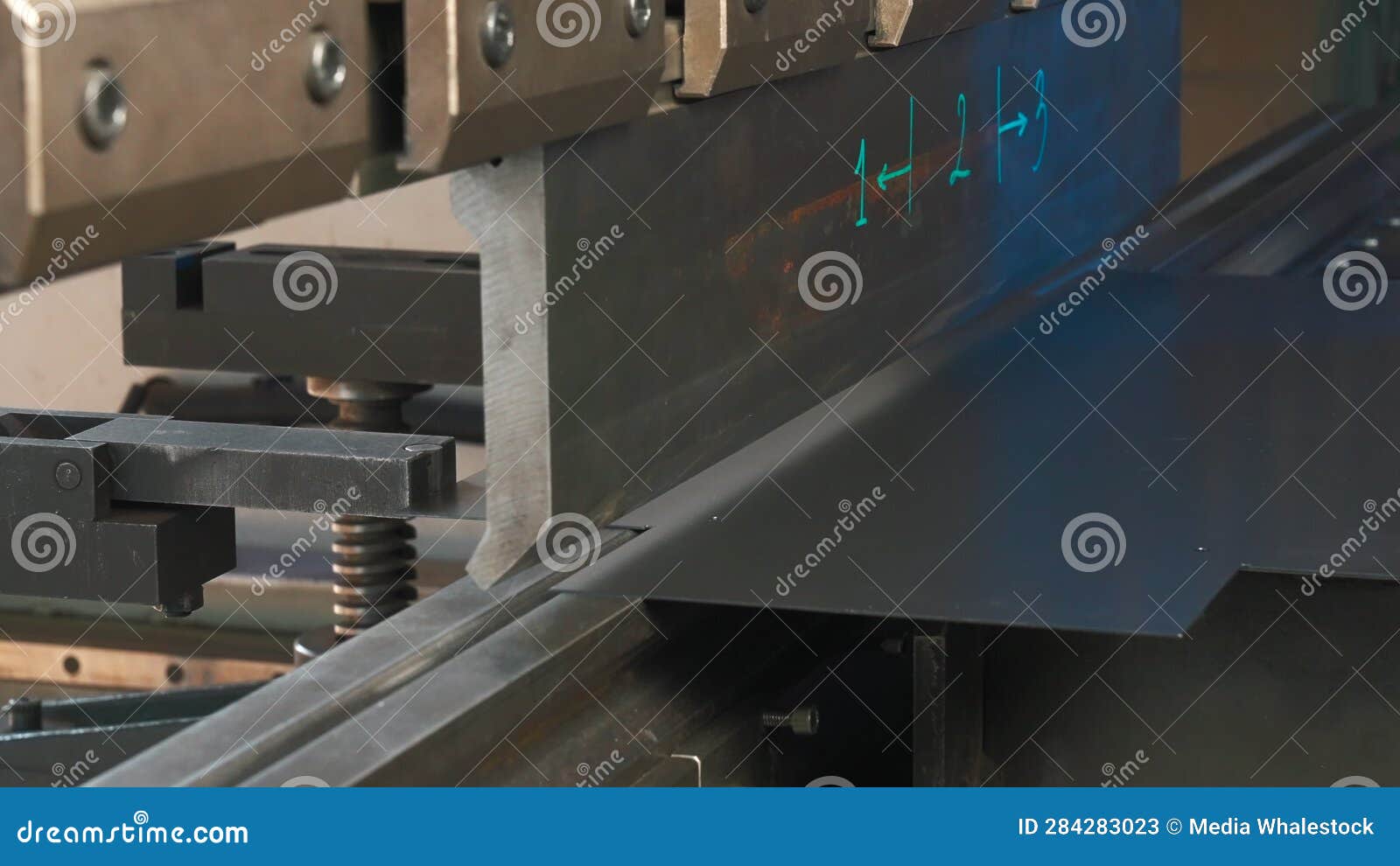 A Metal Sheet Placed on a Machine that Folds it Slowly. Creative ...