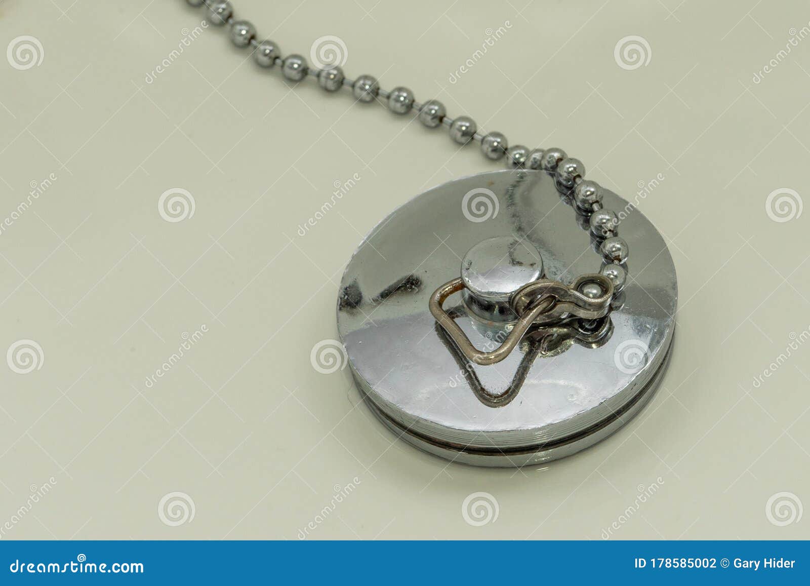 A Metal Sink Plug Attached To a Chain Stock Photo - Image of stainless ...