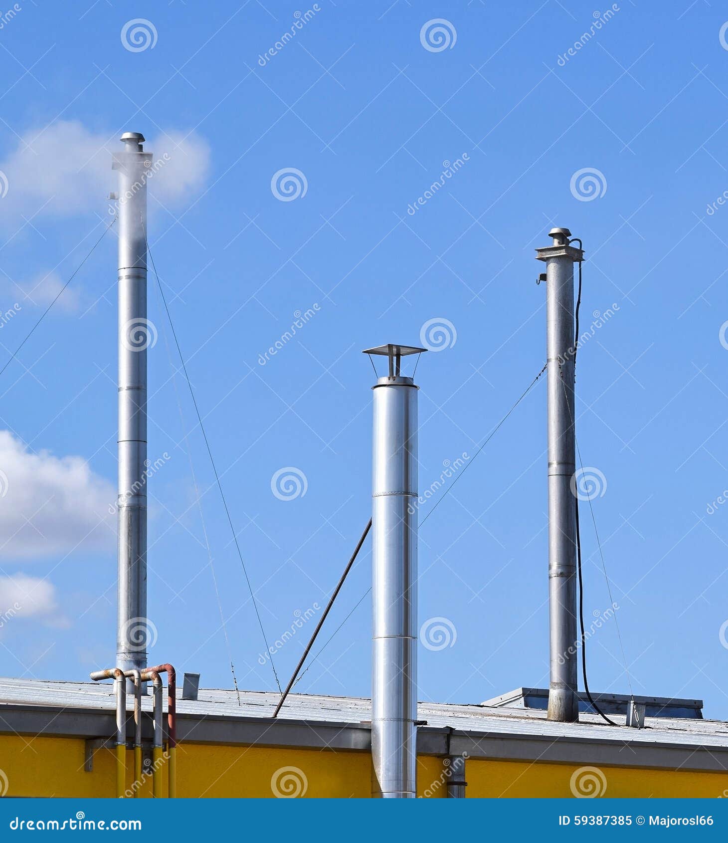 Metal Smoke Stacks of a Factory Stock Image - Image of aerial, green ...
