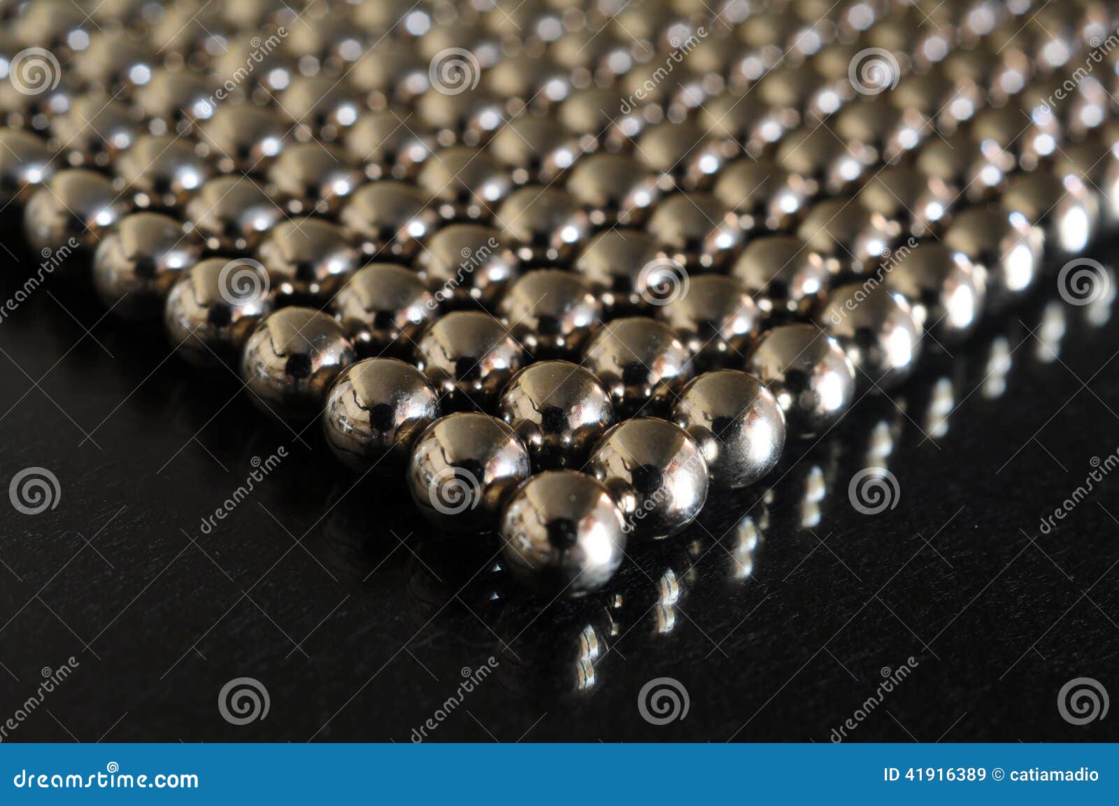 Metal spheres closeup stock image. Image of attraction - 41916389