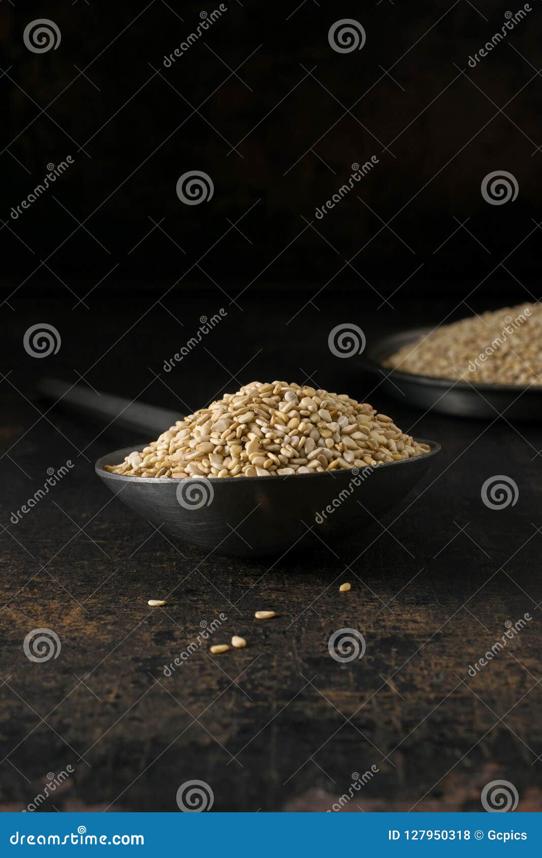 A Metal Spoon and Bowl of Sesame Seeds Stock Photo - Image of sesame ...