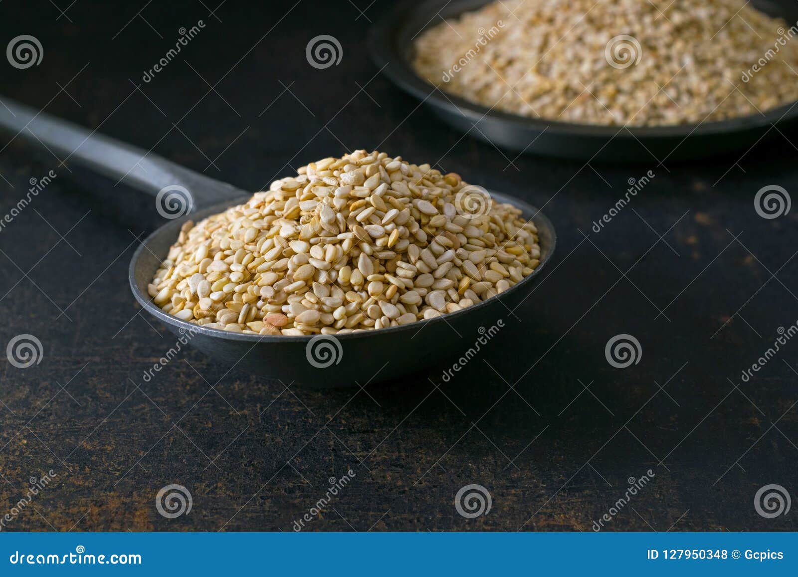 A Metal Spoon Full of Sesame Seeds Stock Photo - Image of scoop ...