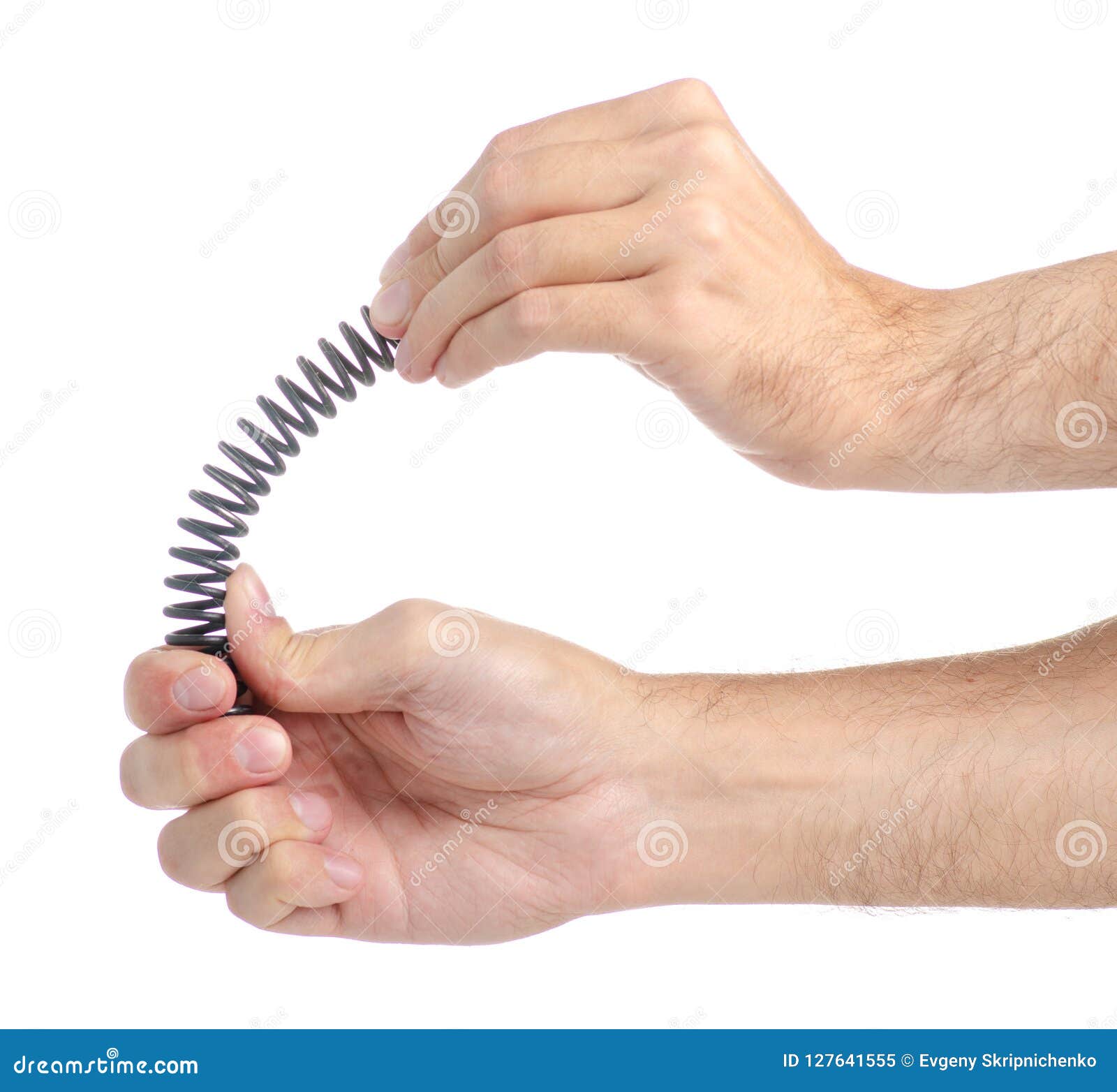 Metal spring in a hand stock image. Image of concept - 127641555