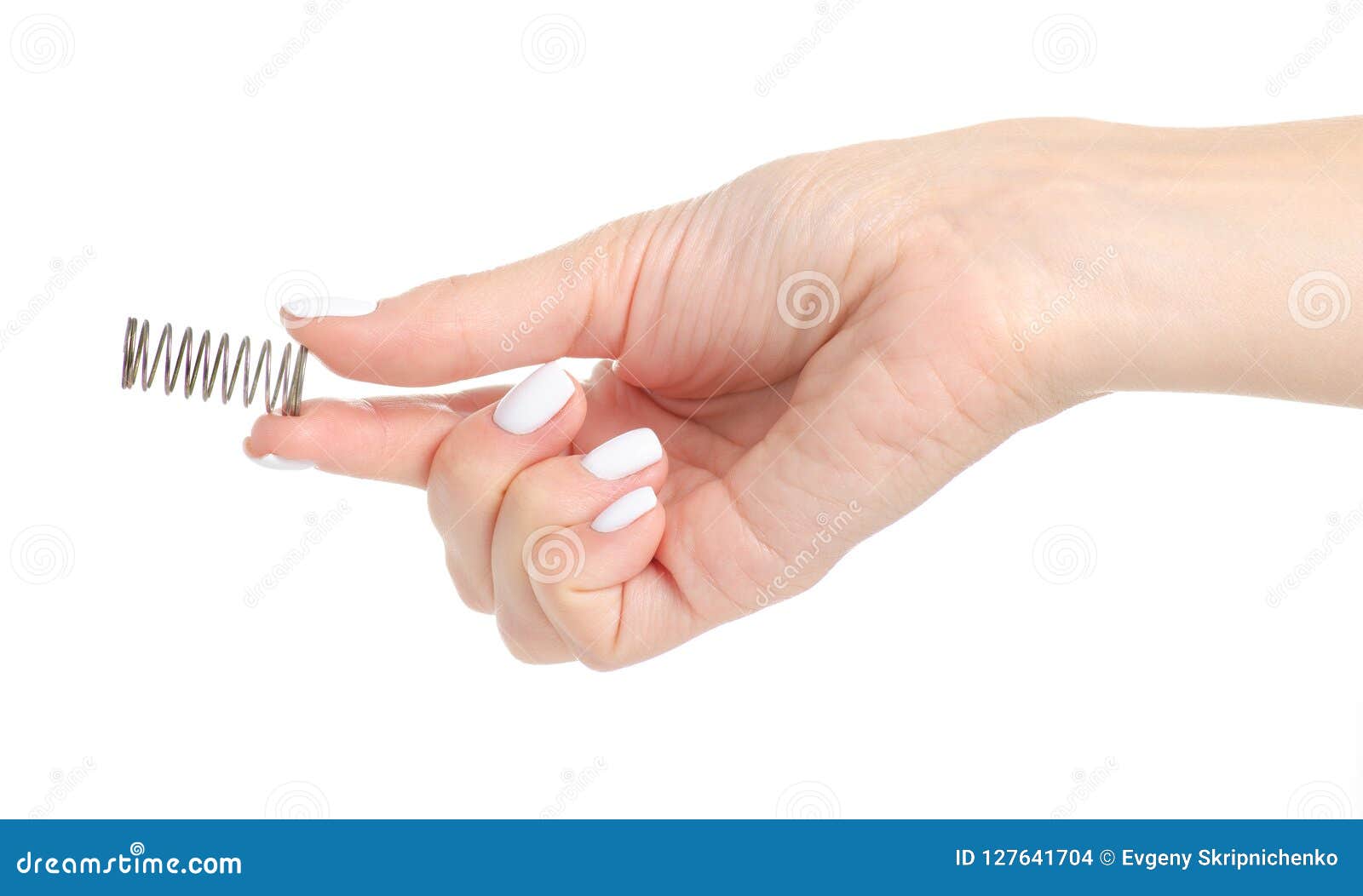 Metal spring in a hand stock photo. Image of human, finger - 127641704