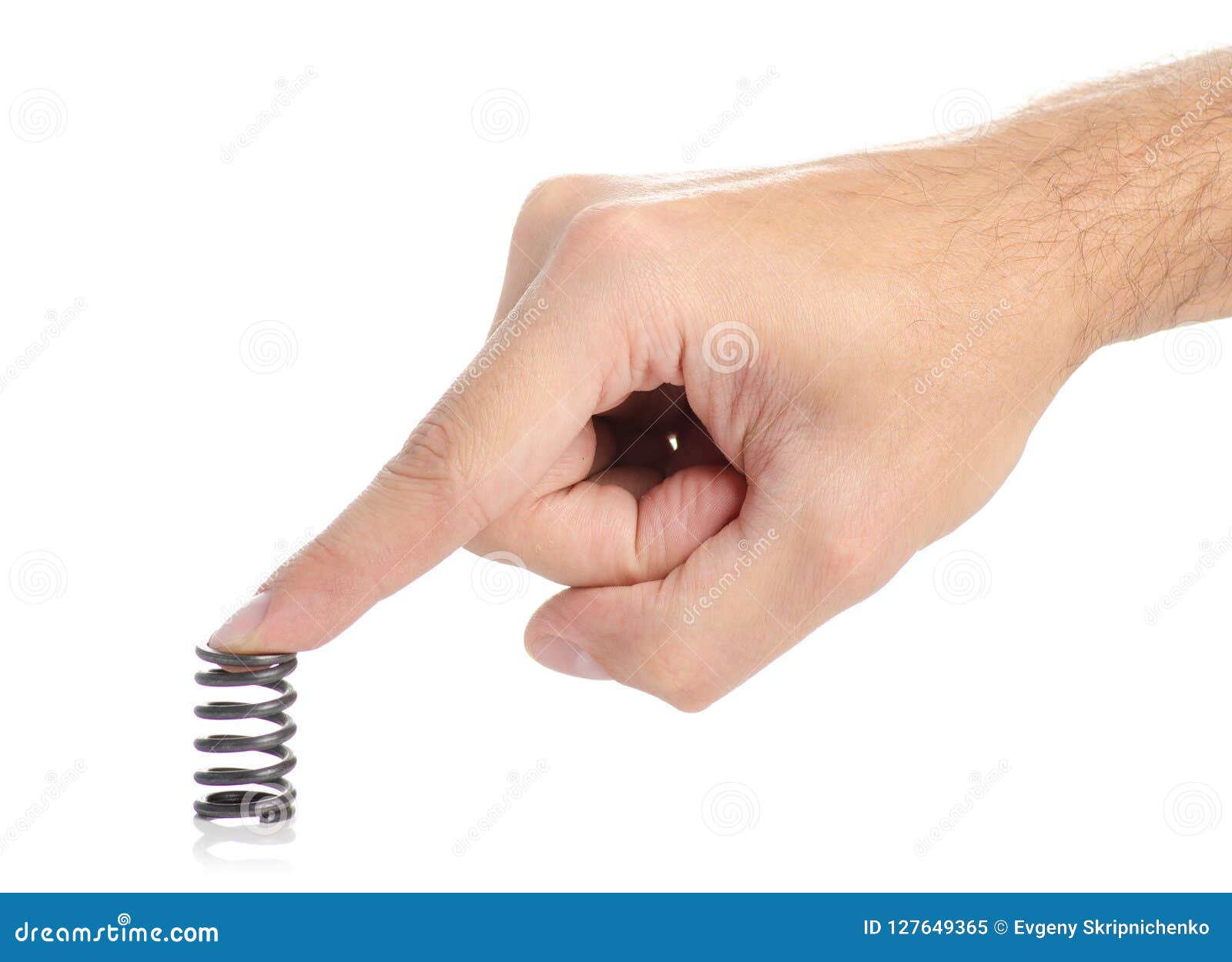 Metal spring in a hand stock image. Image of object - 127649365