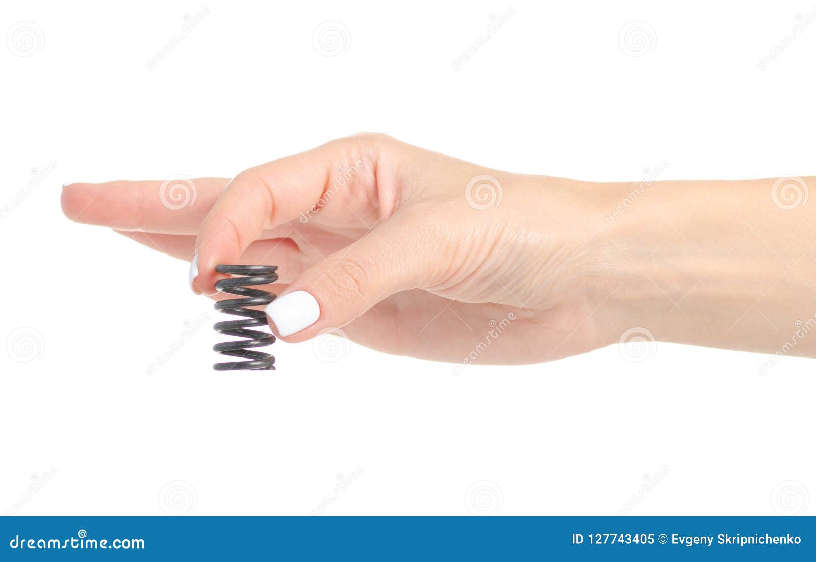 Metal spring in a hand stock image. Image of metal, chrome - 127743405
