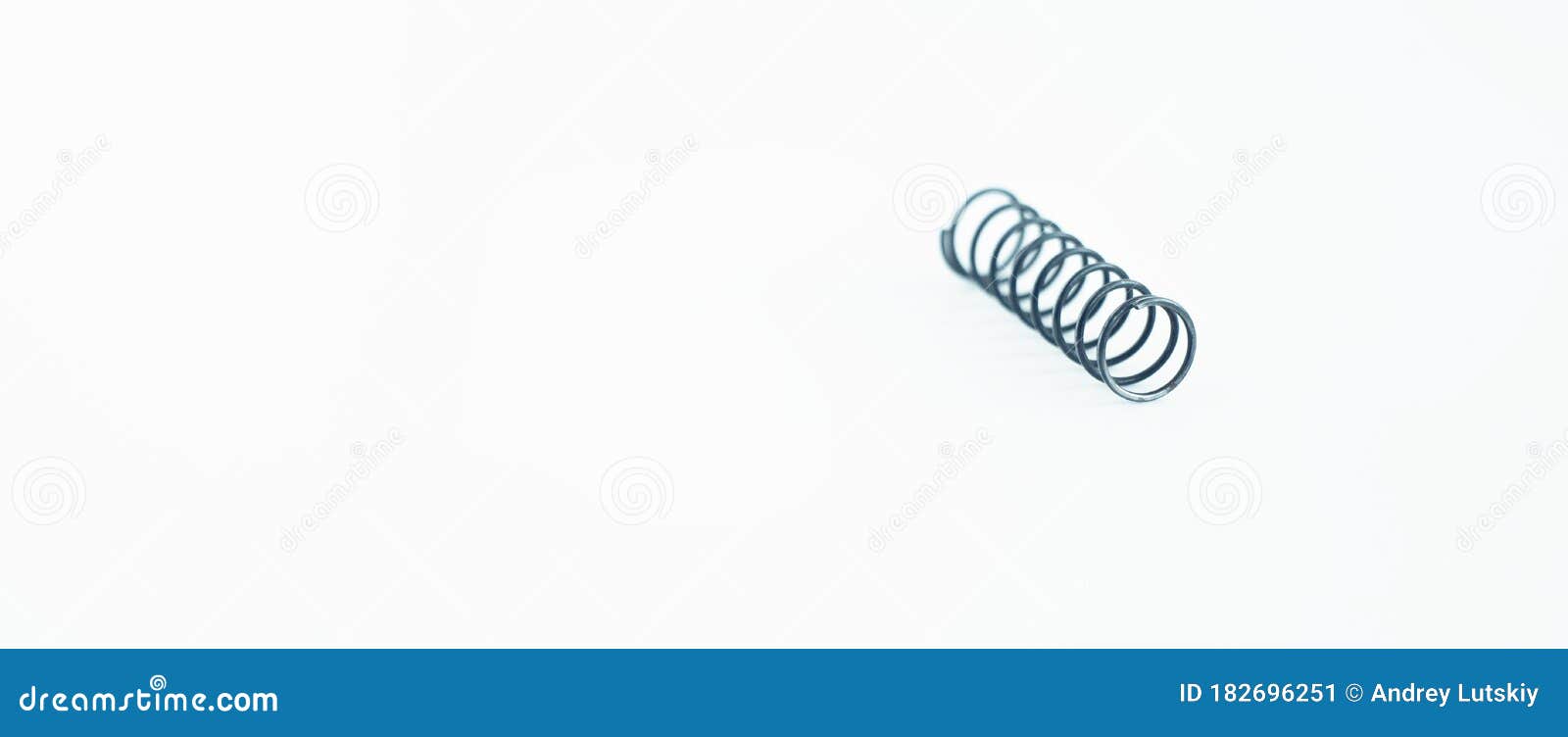 Metal Spring on a White Background Isolate, Place Under the Inscription ...