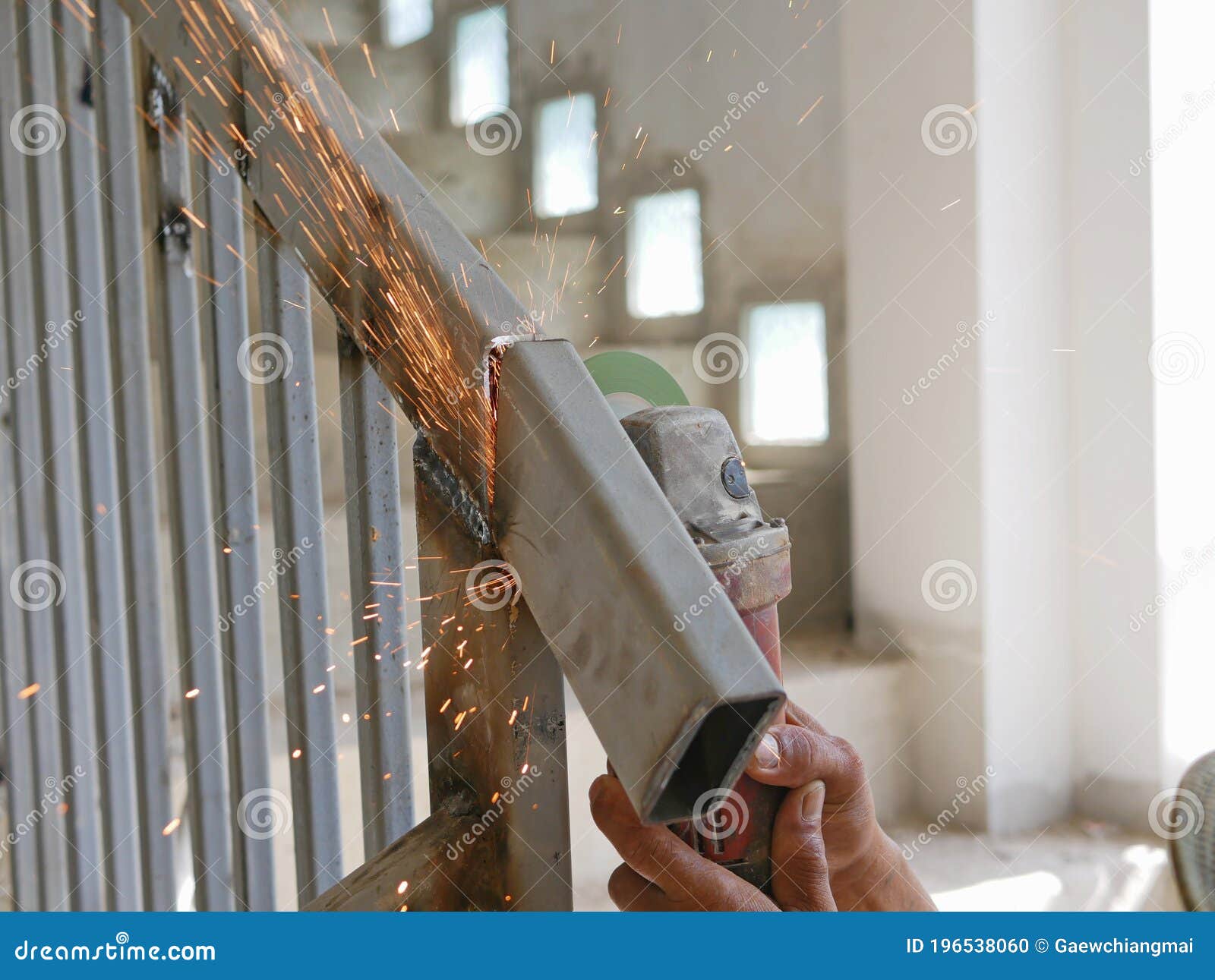 Metal Stair Handrail Being Cut Off Using an Electronic Grinder Stock ...