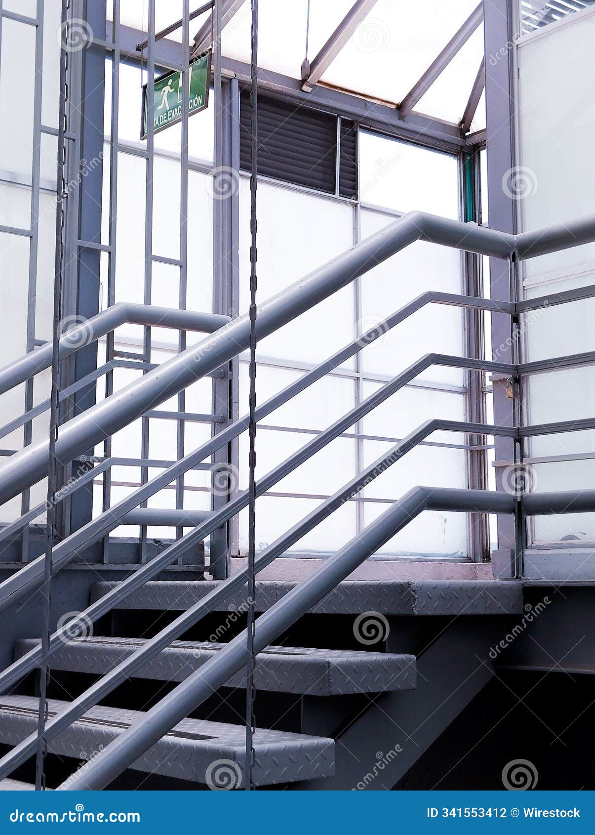 Metal Staircase with an Emergency Exit Sign Stock Photo - Image of ...