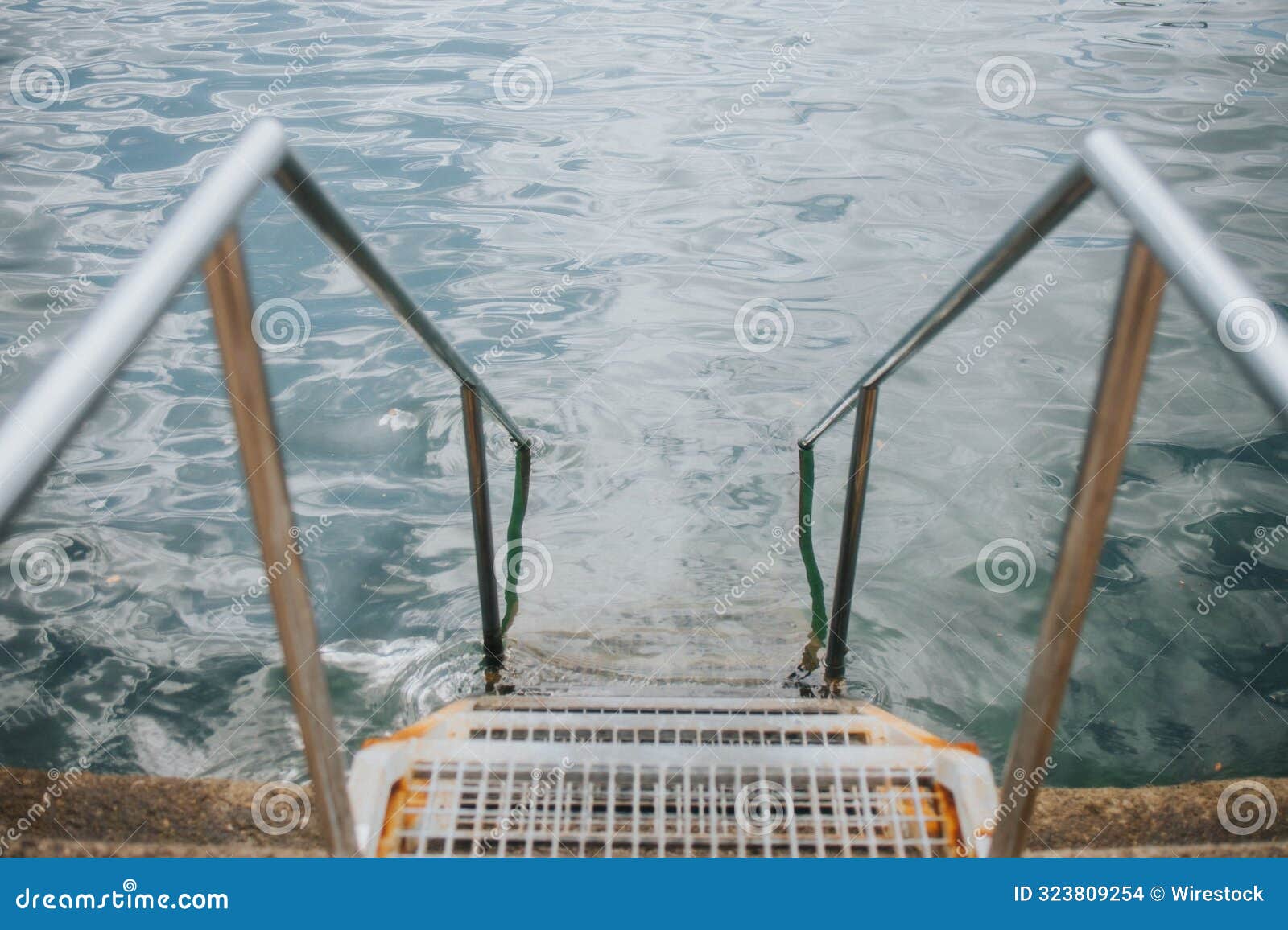 Metal Staircase Leading into Calm Water at a Dock Stock Photo - Image ...