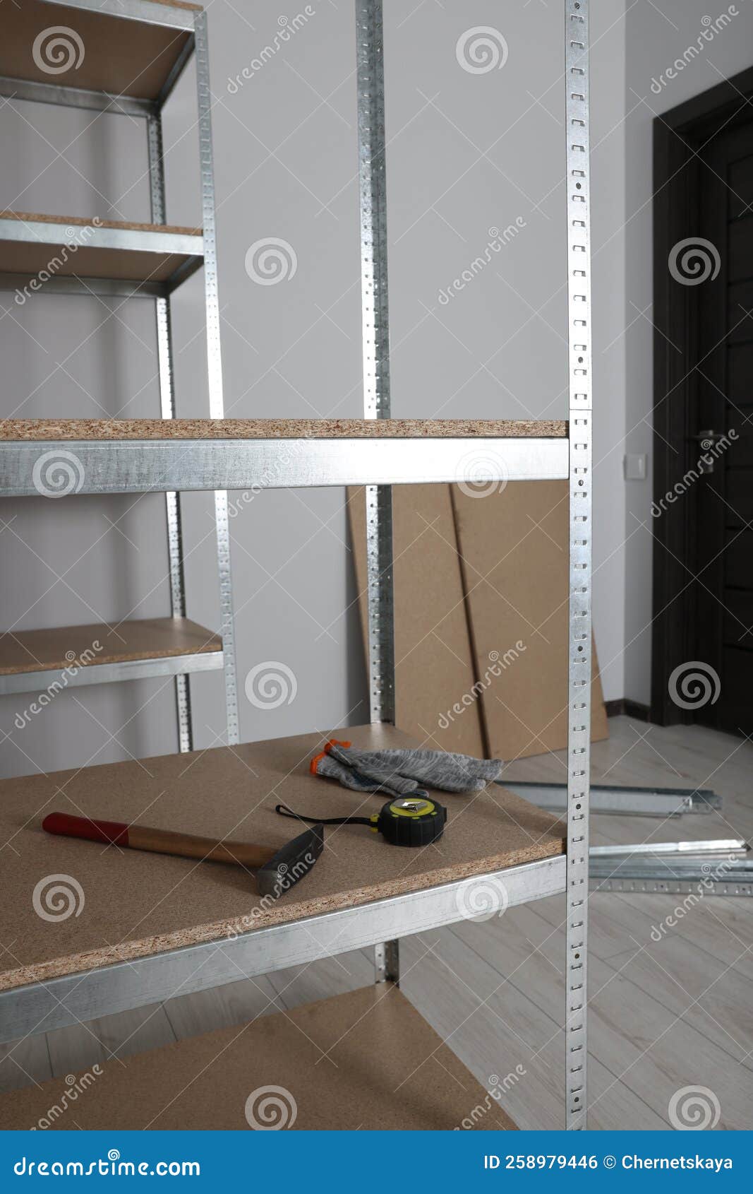 Metal Storage Shelf with Room Renovation Tools in Office Stock Photo ...