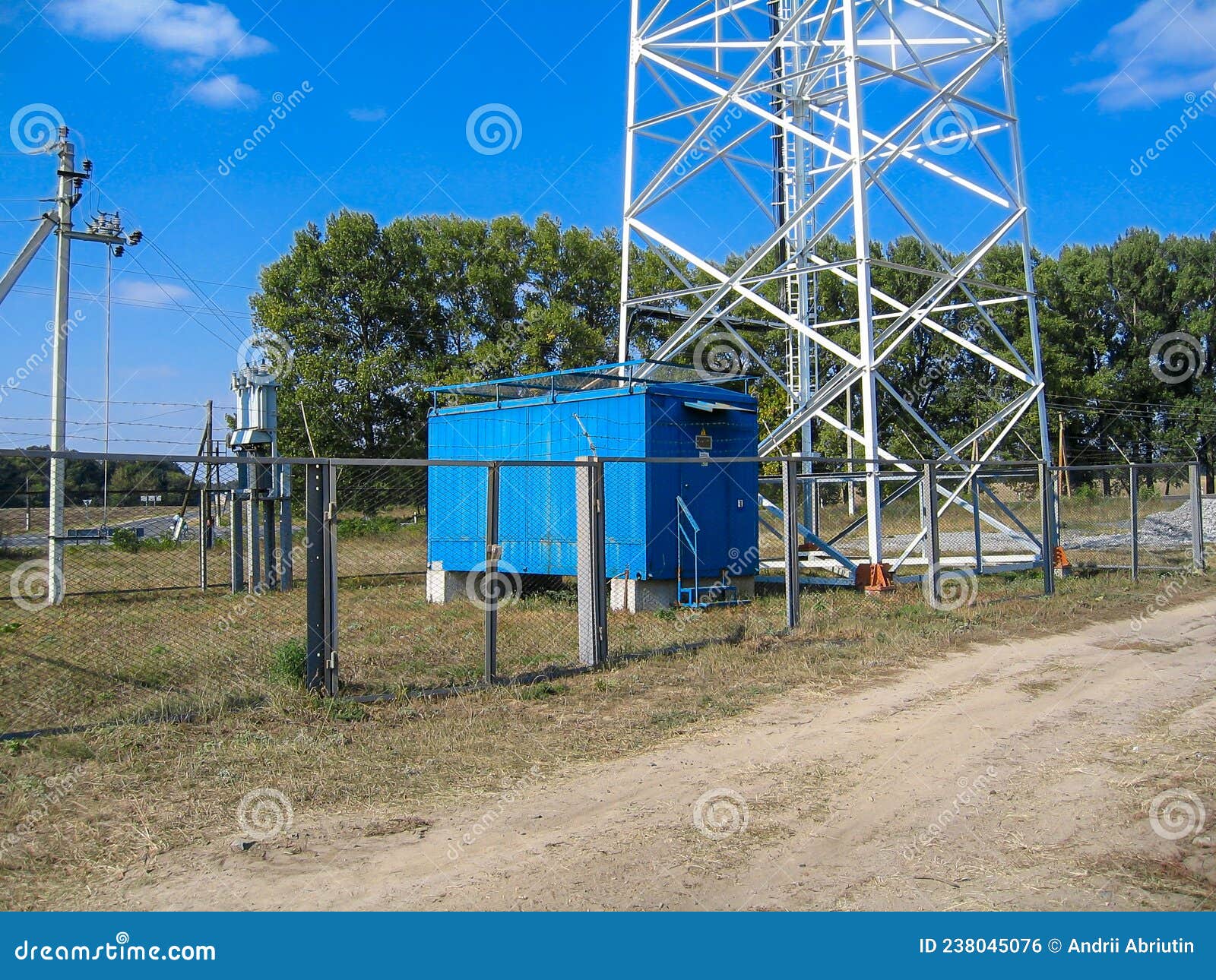 The Metal Structure of the Cell Tower Behind the Fence. Blue Control ...