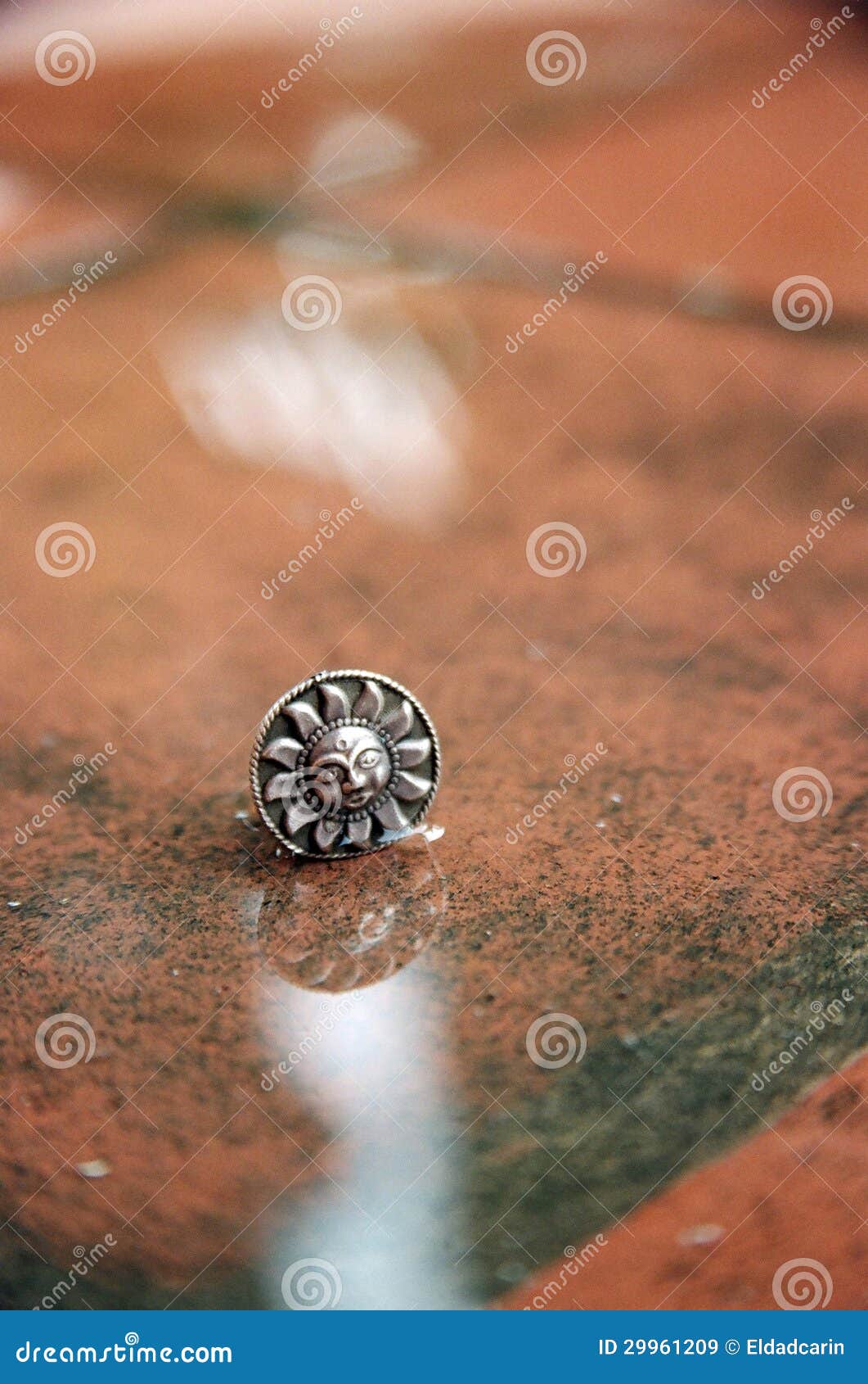 Metal Sun in Puddle stock image. Image of scene, tiled - 29961209