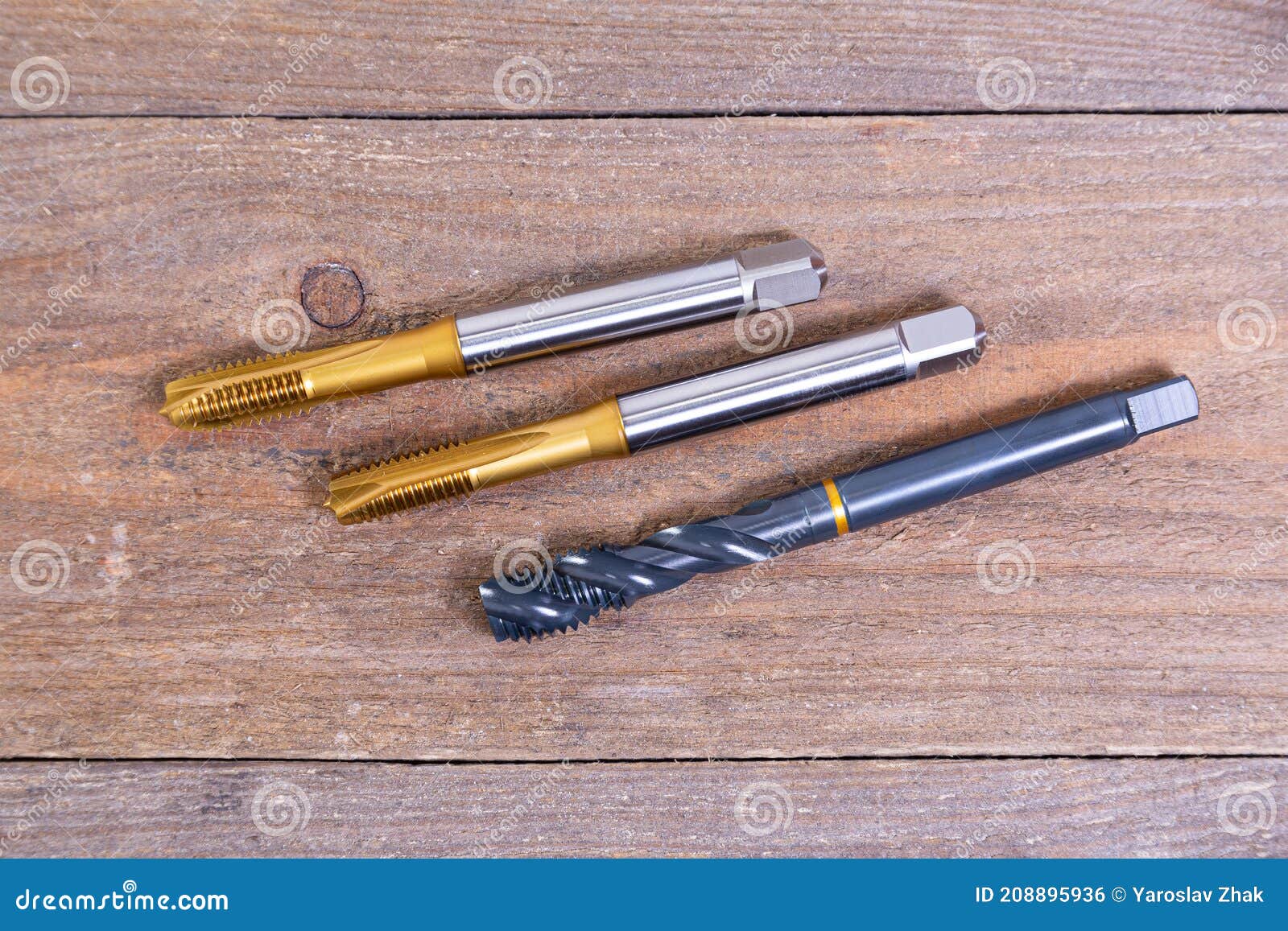 Metal Threading Taps. Tool for Processing Metal on a Wooden Board ...