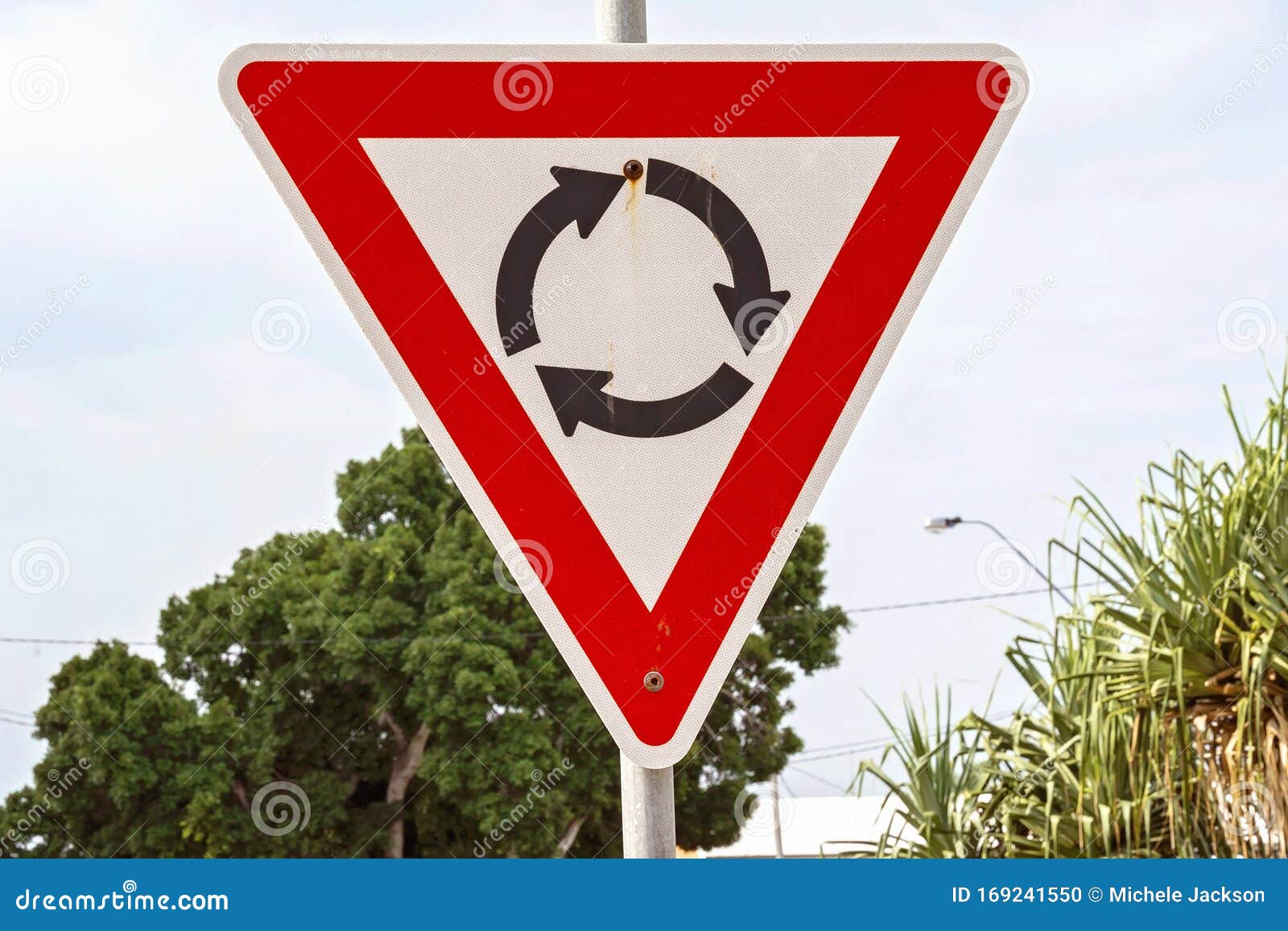 A Metal Triangular Roundabout Sign Stock Photo - Image of road ...