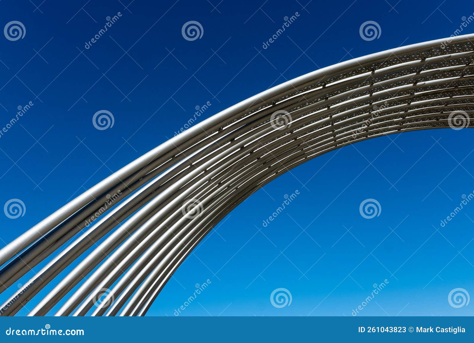 Metal Tubes in Public Space Arching in Front of Clear, Deep Blue Sky ...