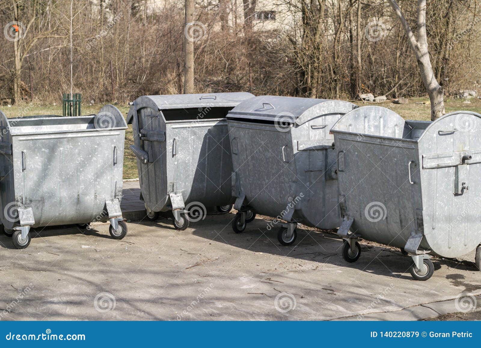 Metal Waste Container with Wheels.Four Empty Garbage Bin Stock Image ...