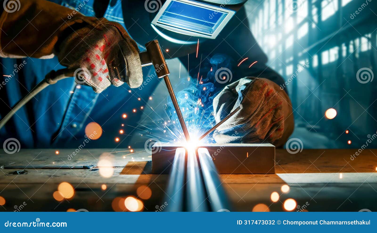 Metal Welding in a Factory, Using an Electric Arc Welding Machine. the ...