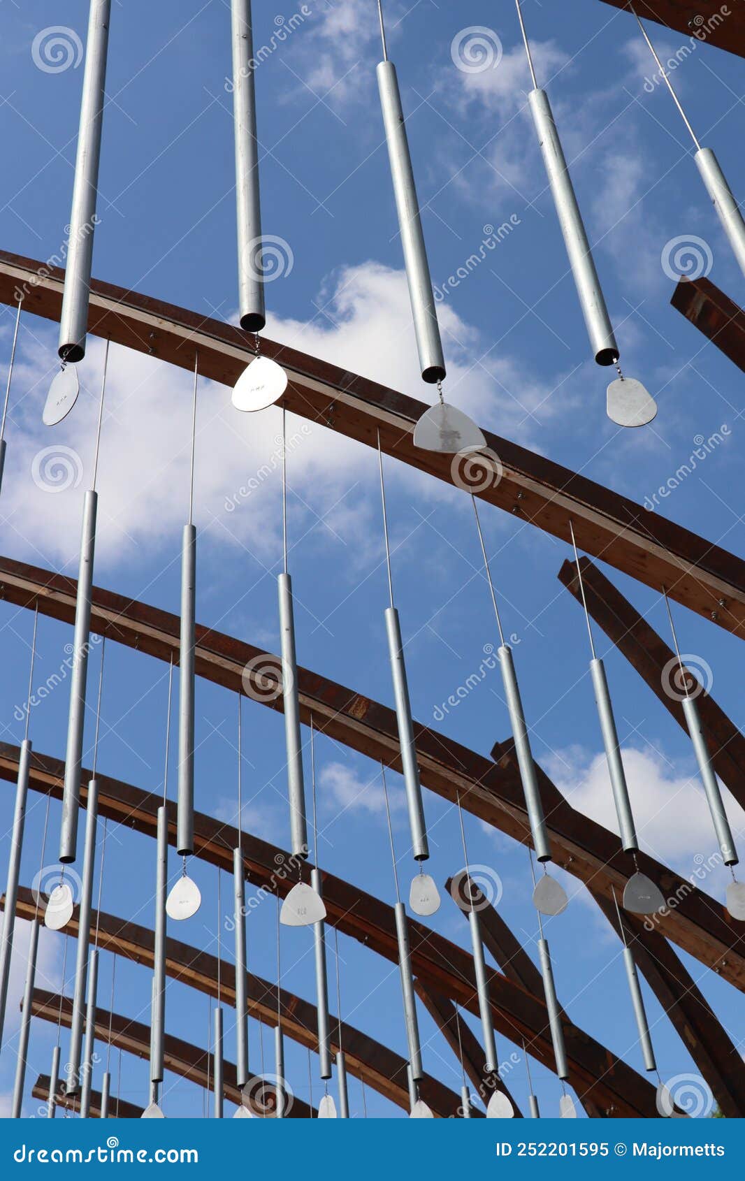 Metal Wind Chime Sculpture Against Sky, Three Rows Stock Image - Image ...