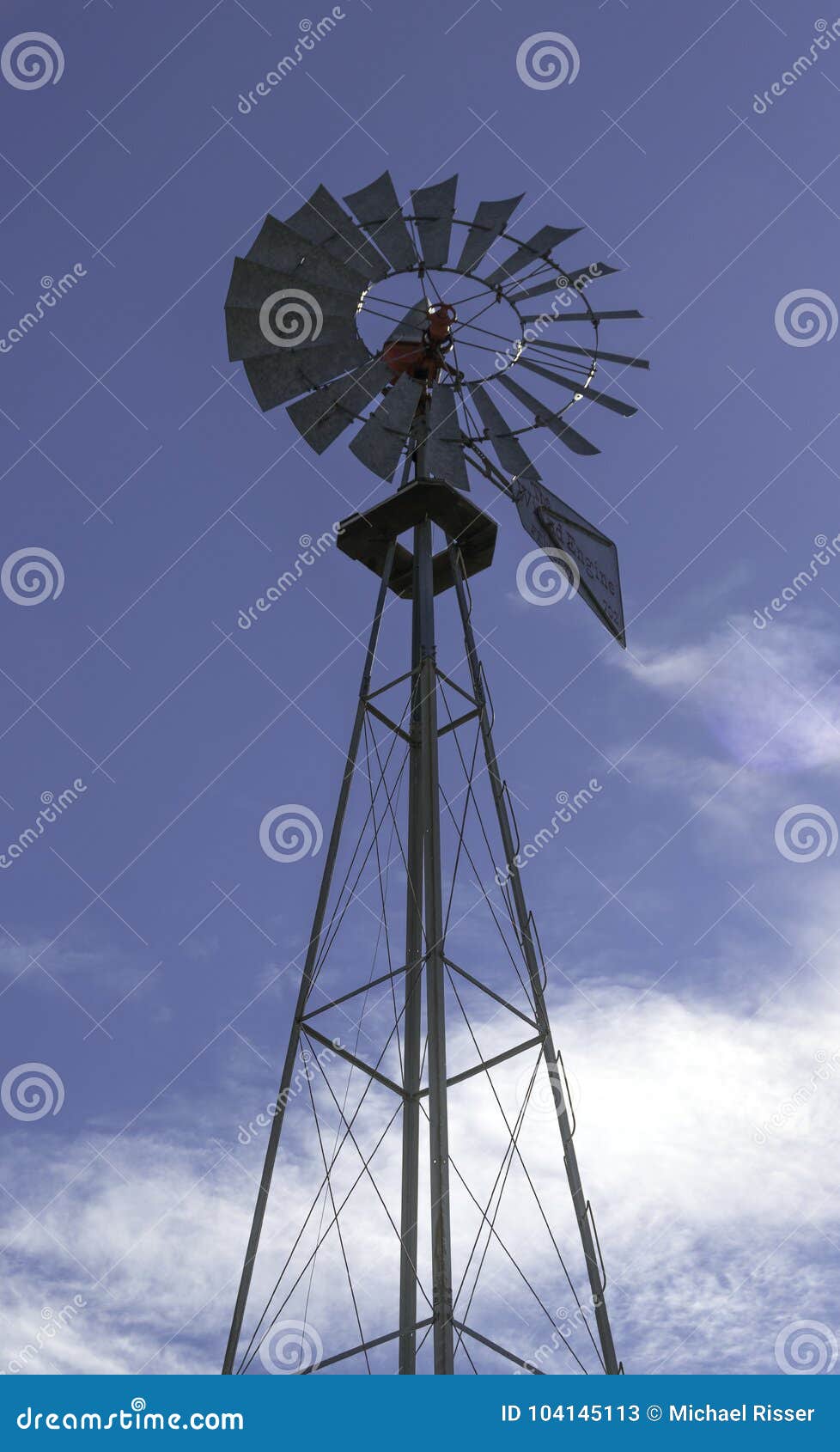 Metal Windmill Against Blue Sky and White Clouds Editorial Stock Photo ...