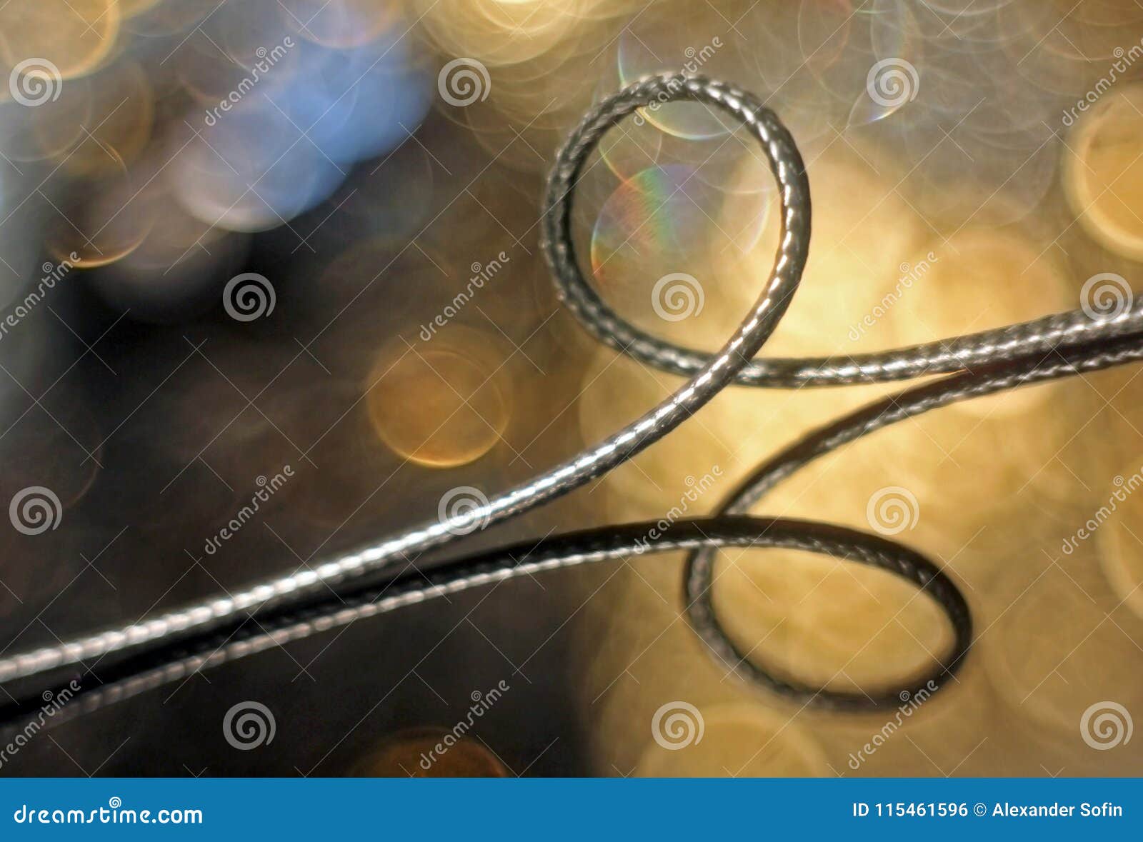 Metal Wire Lying on the Mirror with Reflection and Twisted into Stock ...