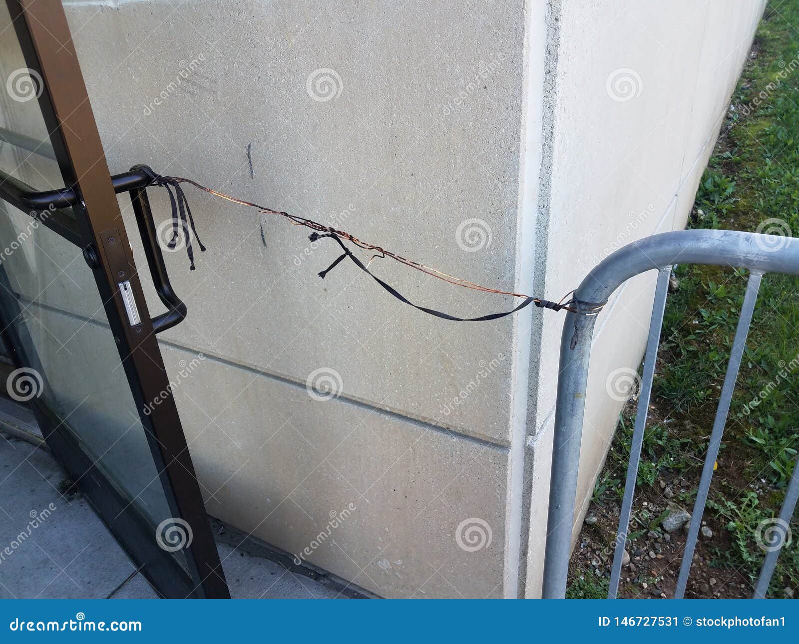 Metal Wire and String Holding Door Open and Cement Wall Stock Image ...