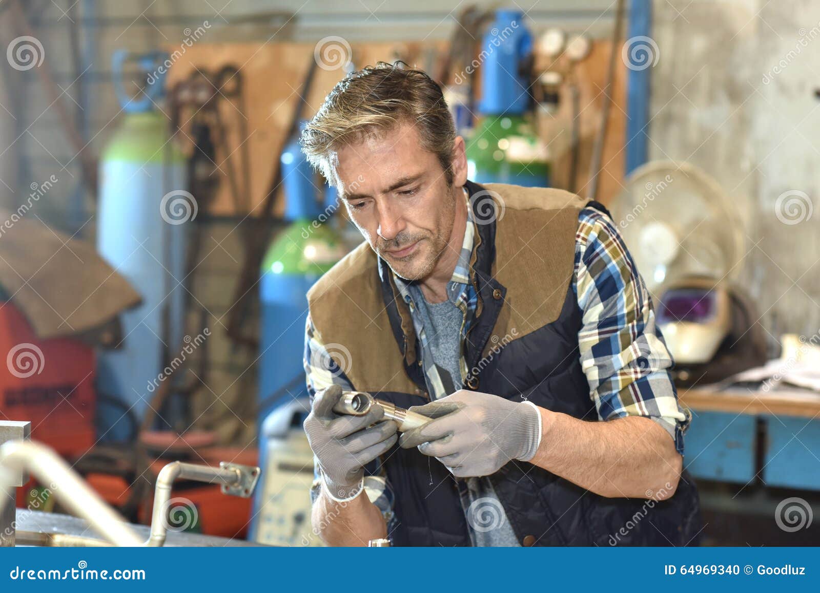 Metal worker assembling stock photo. Image of warehouse - 64969340