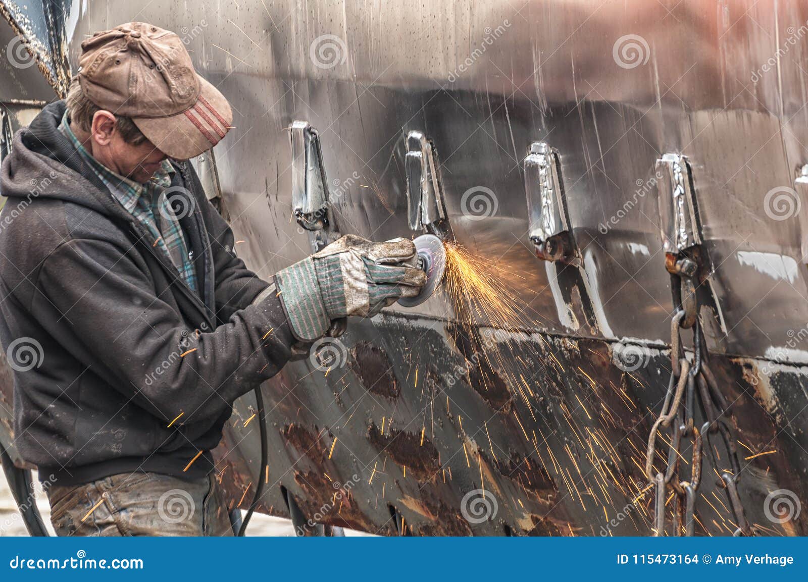 A metal worker is grinding editorial stock image. Image of grinder ...