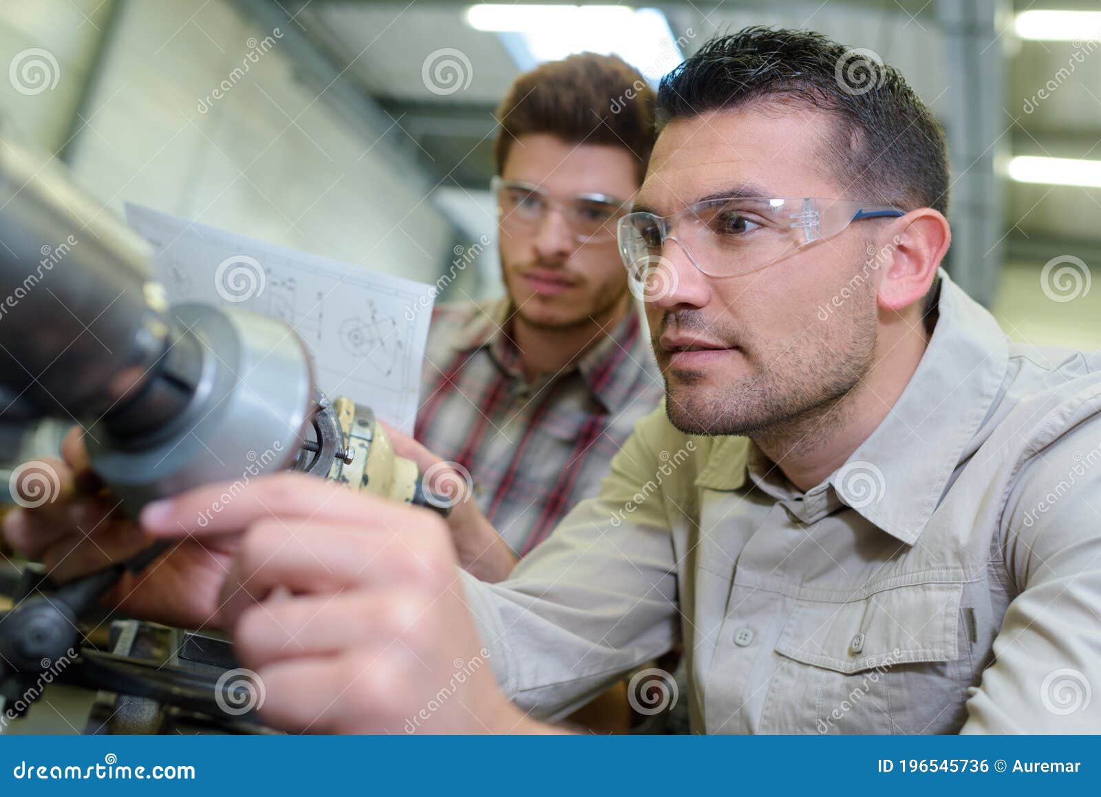 Metal Worker Showing Demonstration To Apprentice Stock Photo - Image of ...