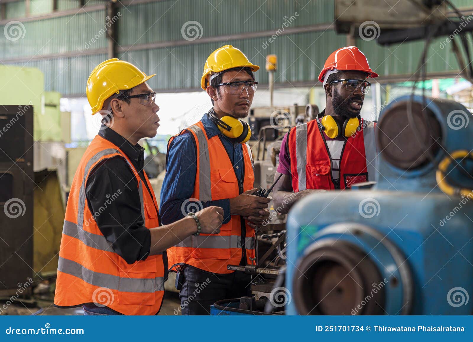 Metal Worker Teaching Trainee on Machine. Engineer Men Wearing Uniform ...