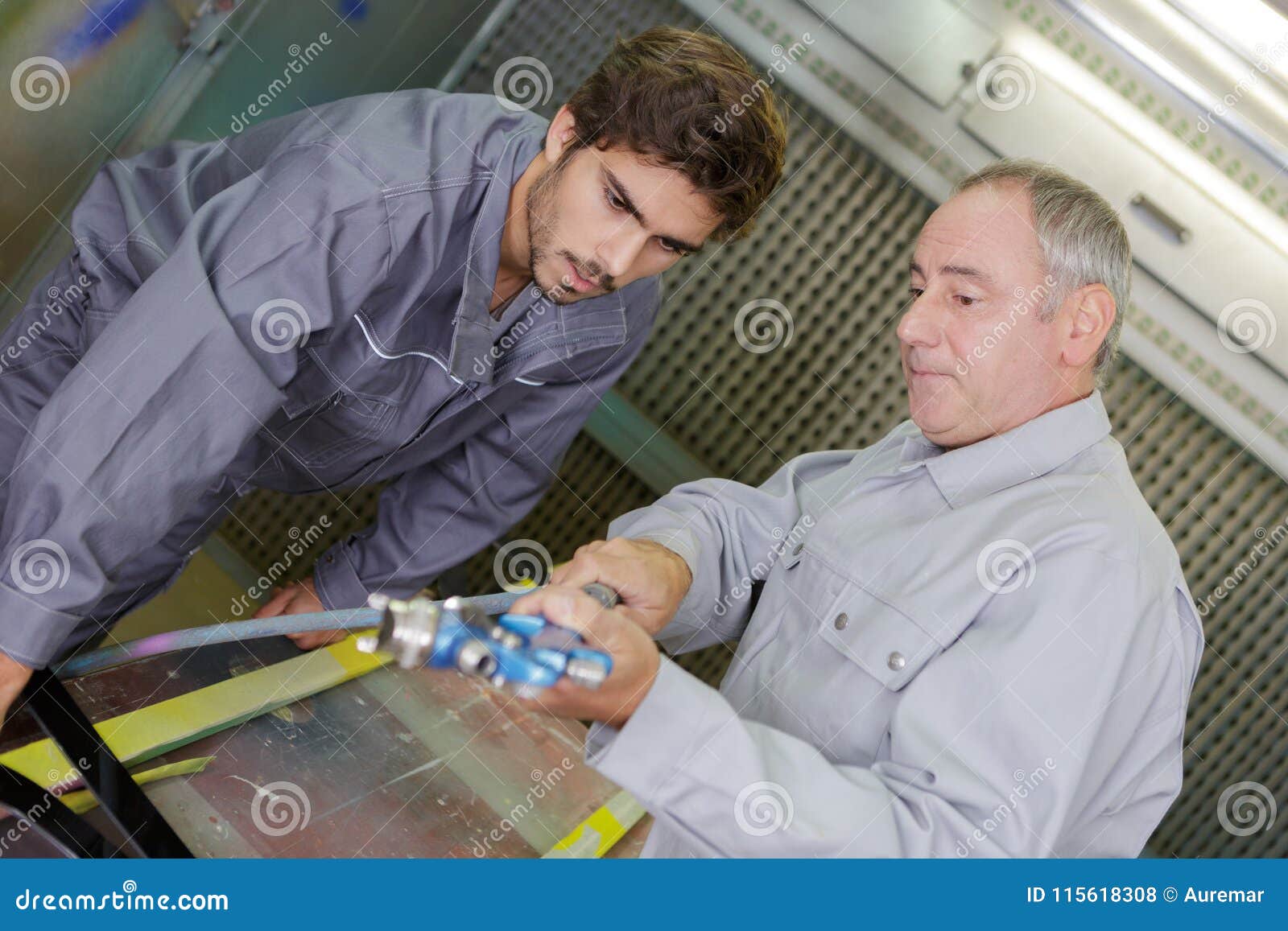Metal Worker Teaching Trainee on Machine Use Stock Photo - Image of ...