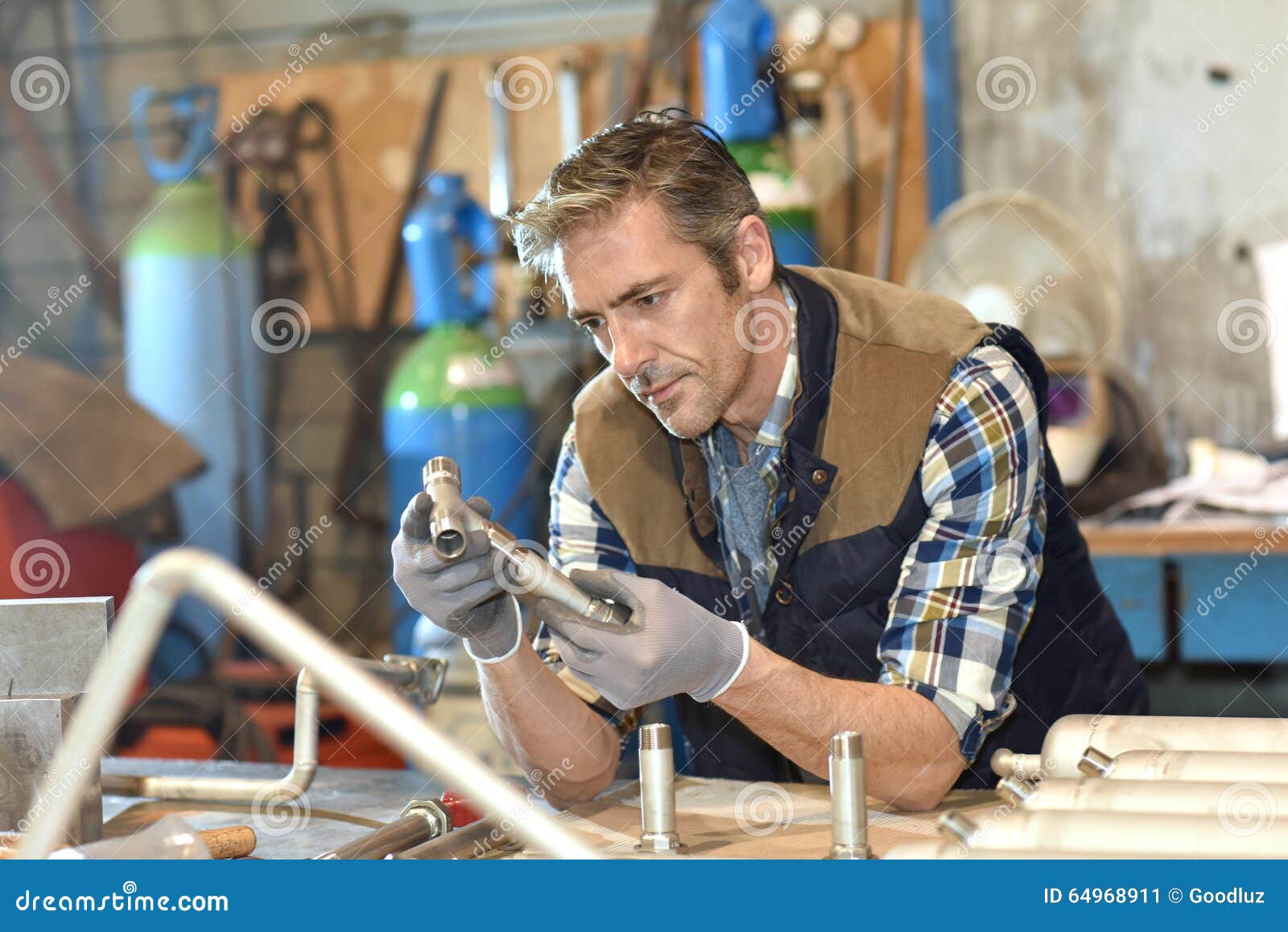 Metal worker at workshop stock image. Image of coppersmith - 64968911