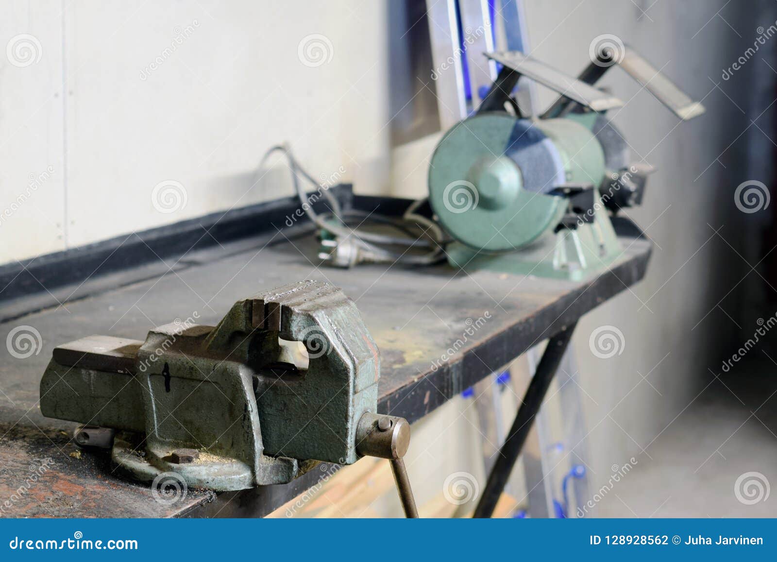 Metal Workshop. Vise and Bench Grinder on Metallic Workbench Stock ...