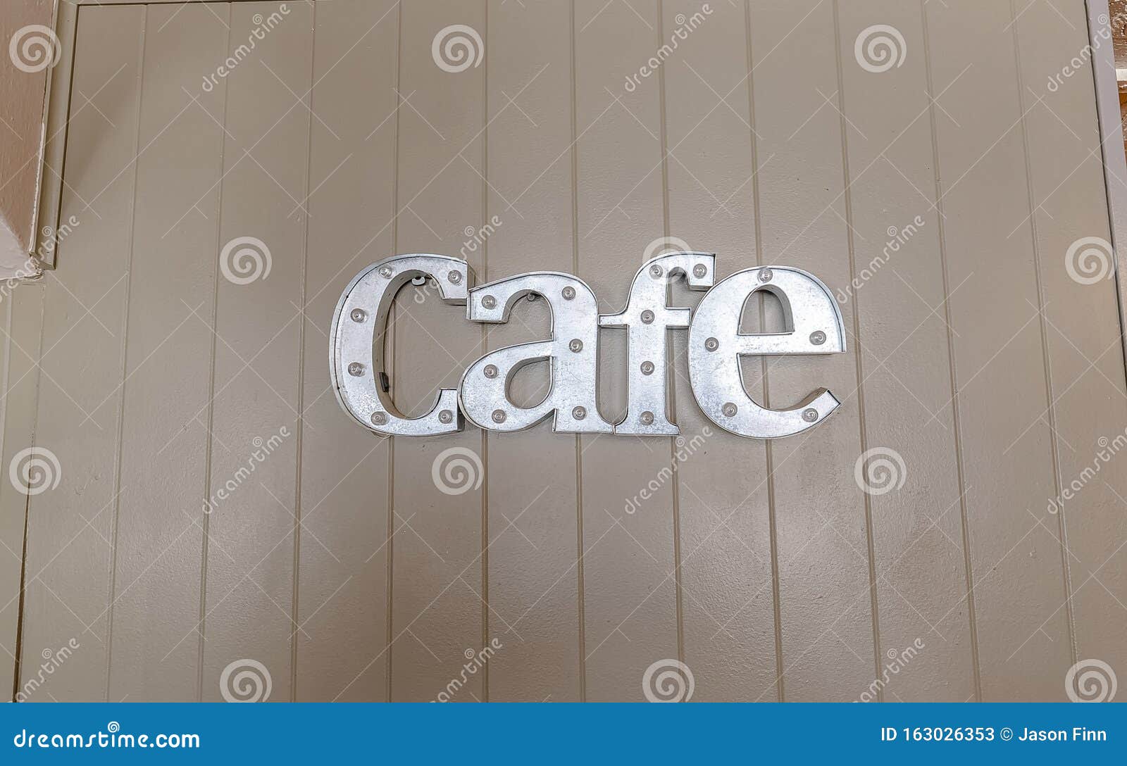 Metallic Cafe Sign on a Building Wall Stock Image - Image of board ...